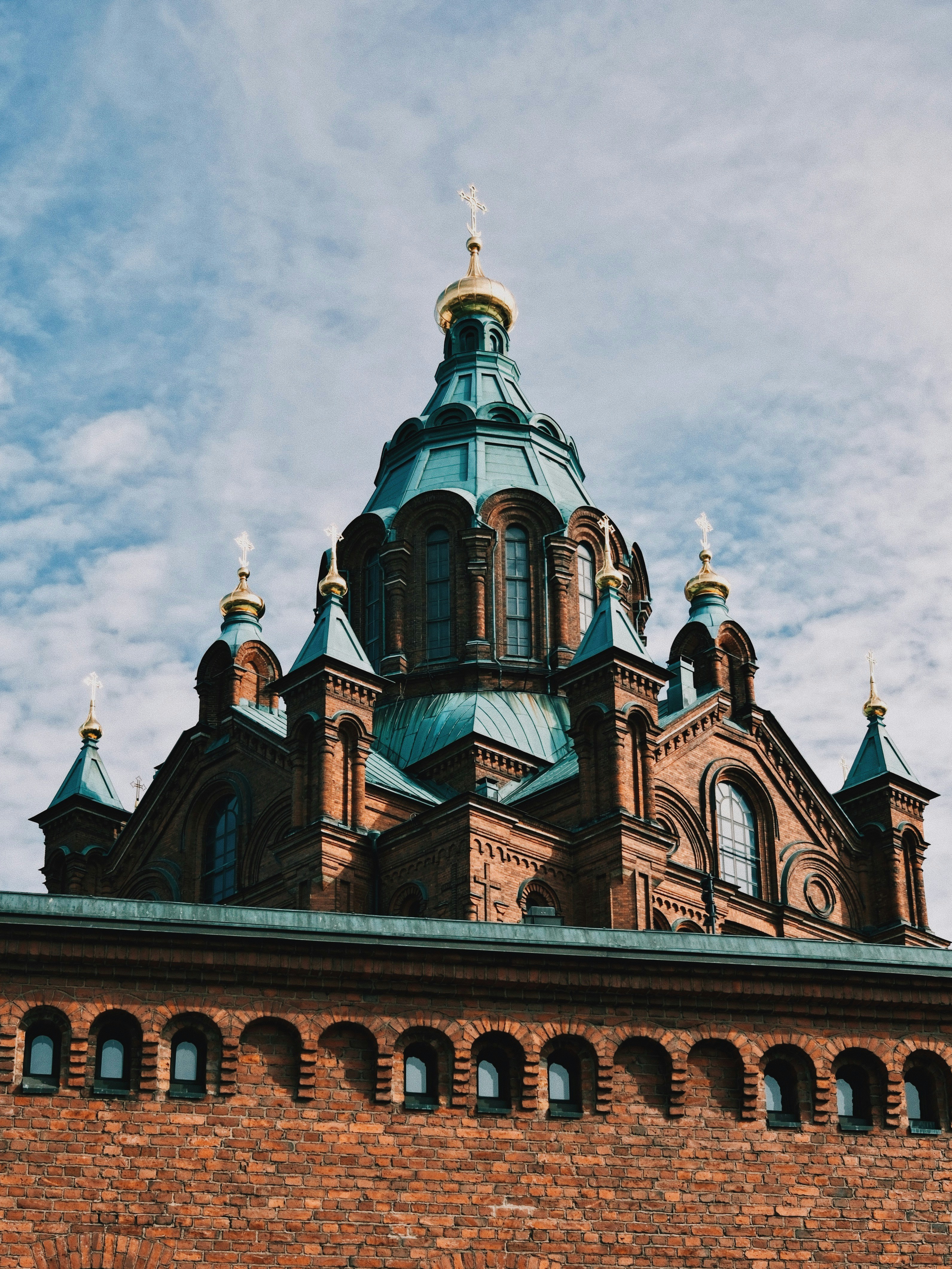 Ceremonial Domes: Brickwork and Turrets Rise Above the Parapet