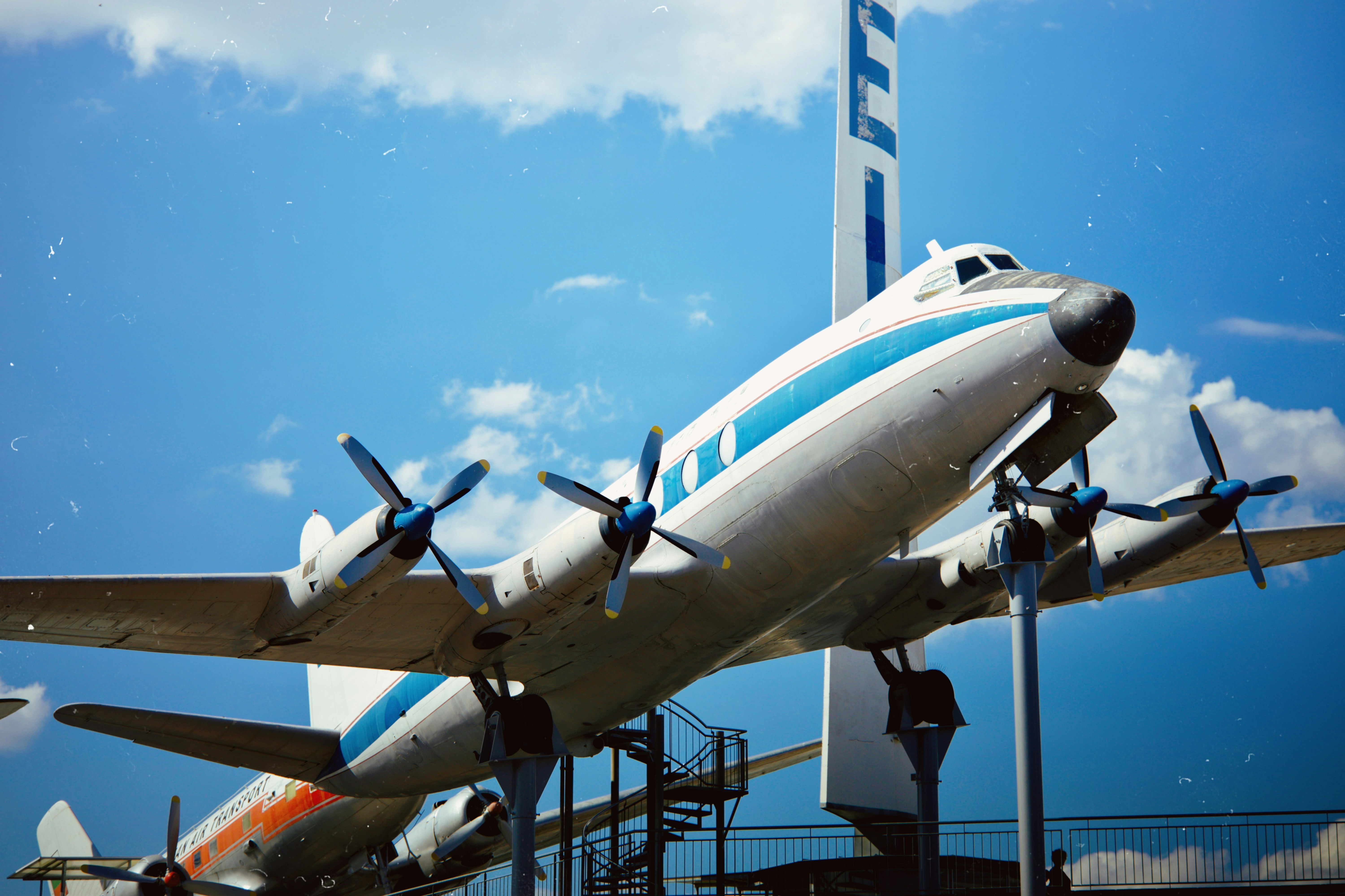 Vintage Airliner on Display: A Skyward Perspective of a Prop-Driven Exhibit