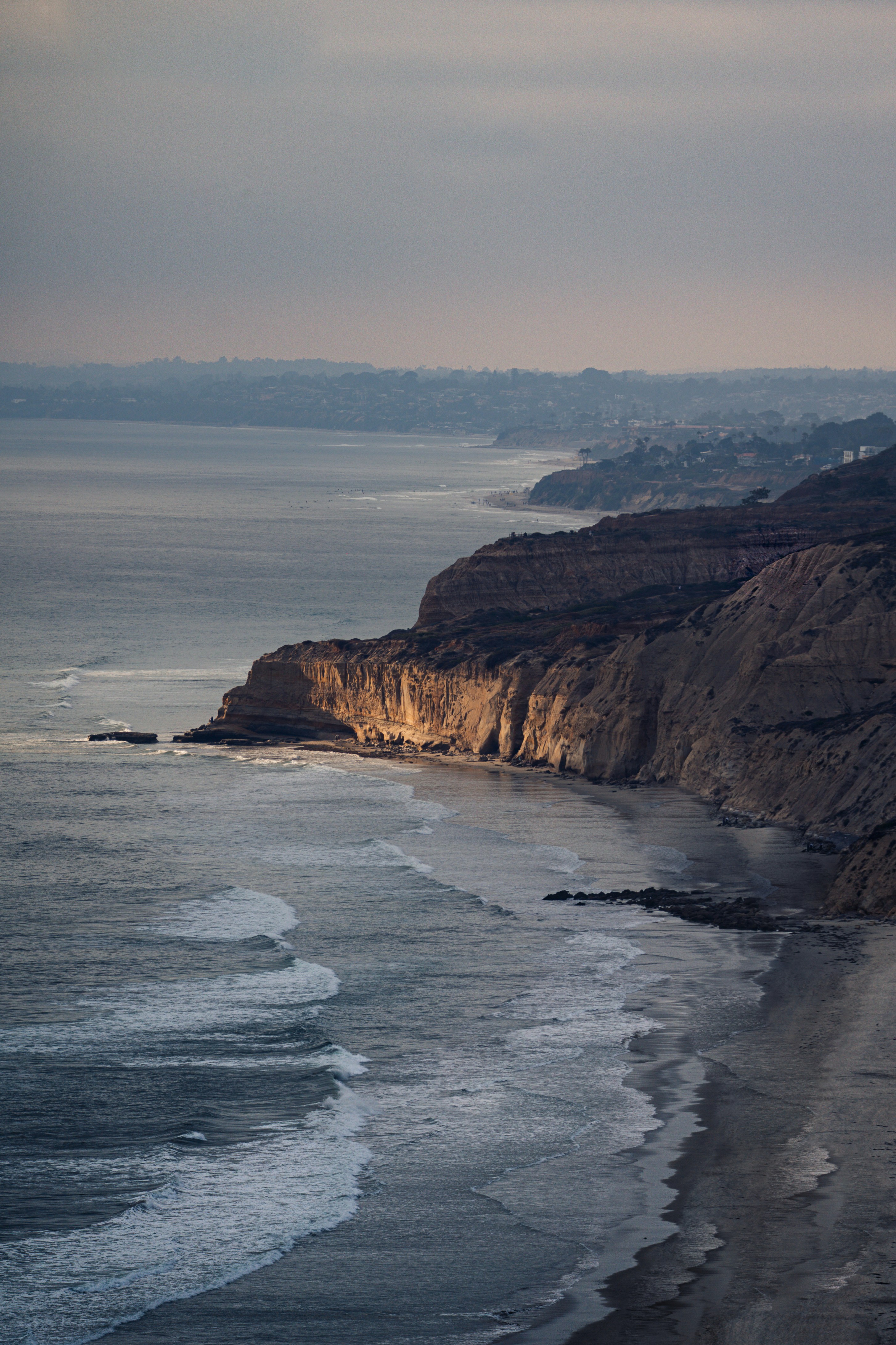 Golden Cliffline: Sunlit Strata Along a Quiet Coast