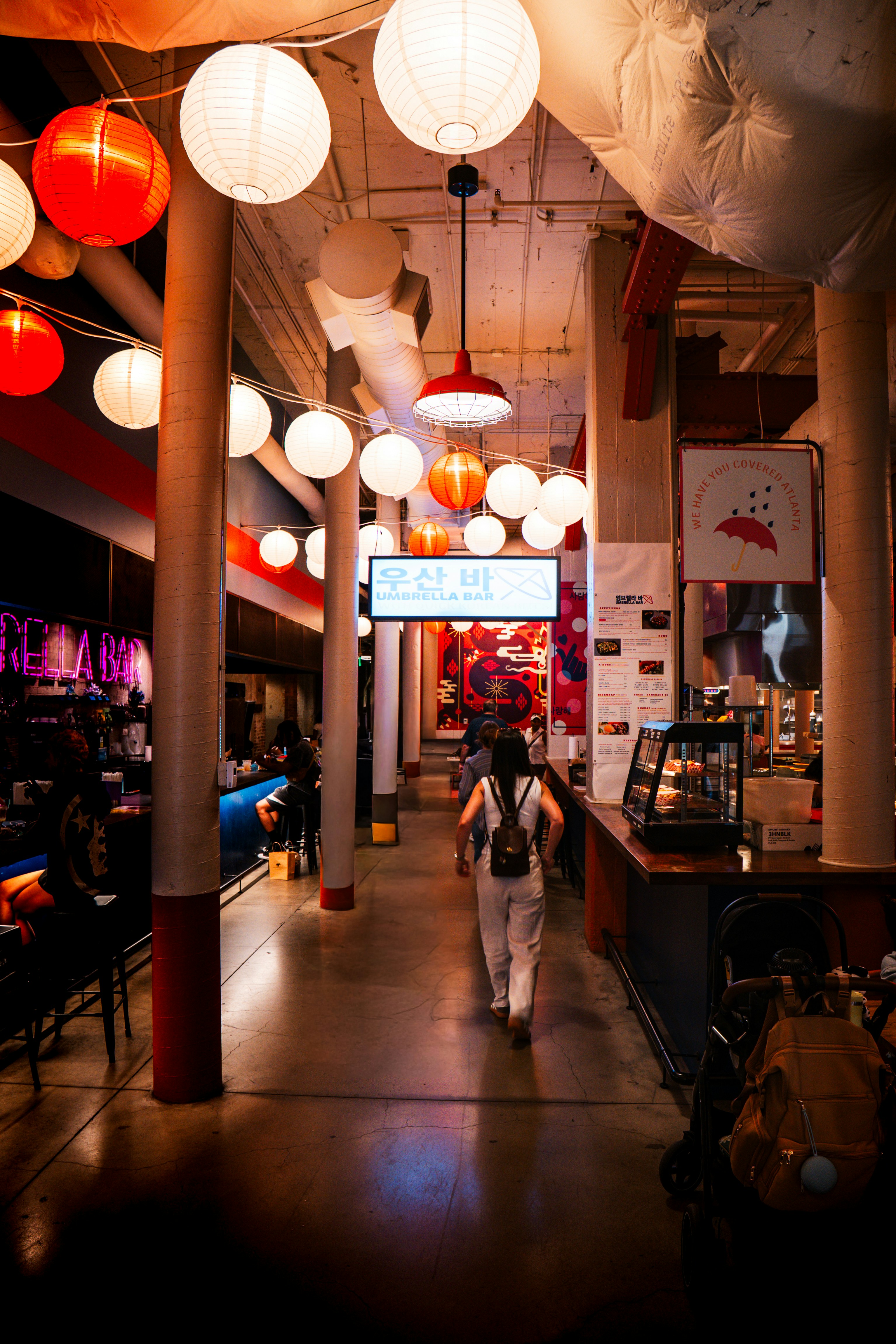 Lantern-lit Corridor to a Neon Café