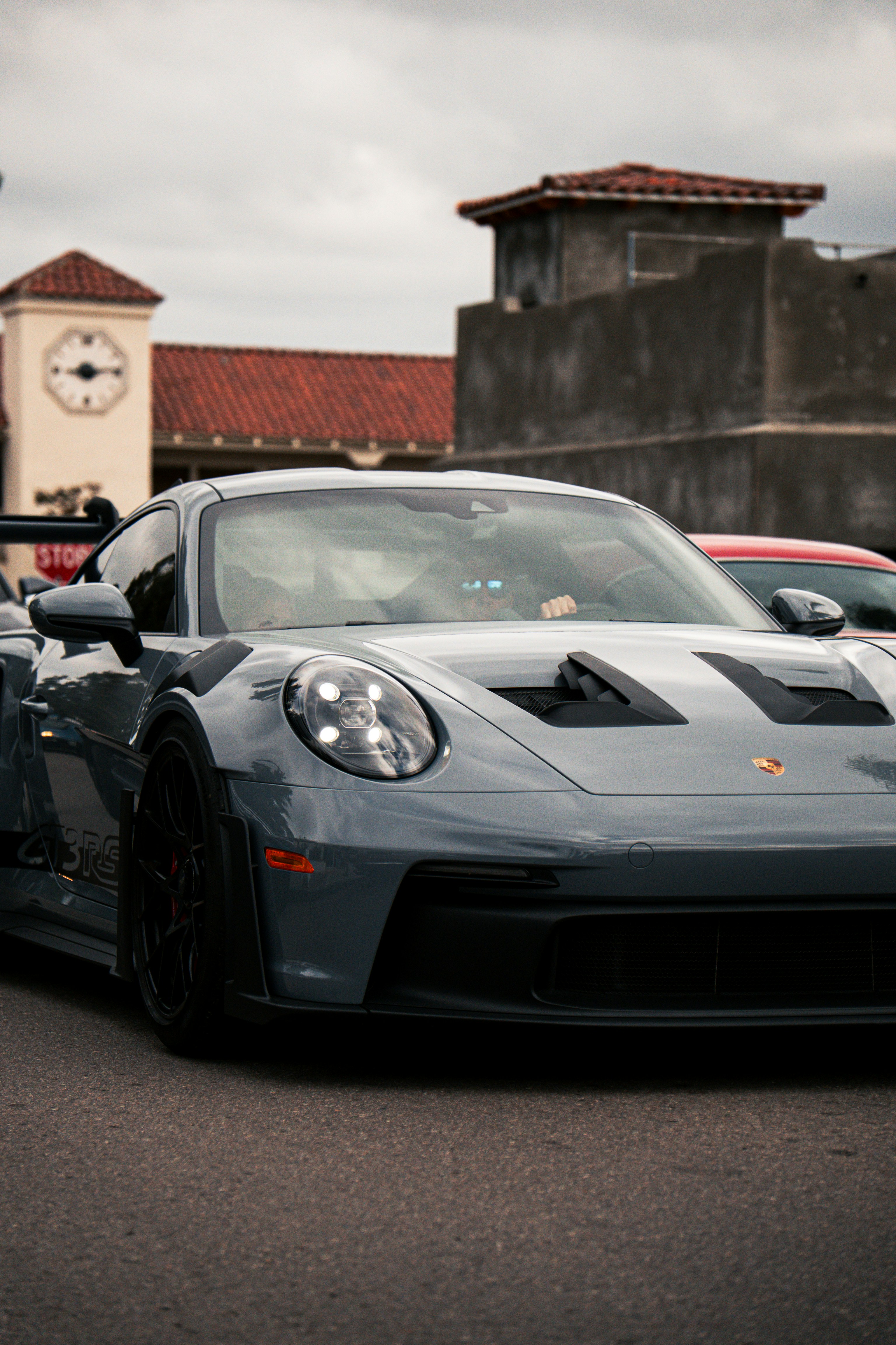 Low-angle Focus: Porsche 911 GT on a Hazy Sunset Parking Lot