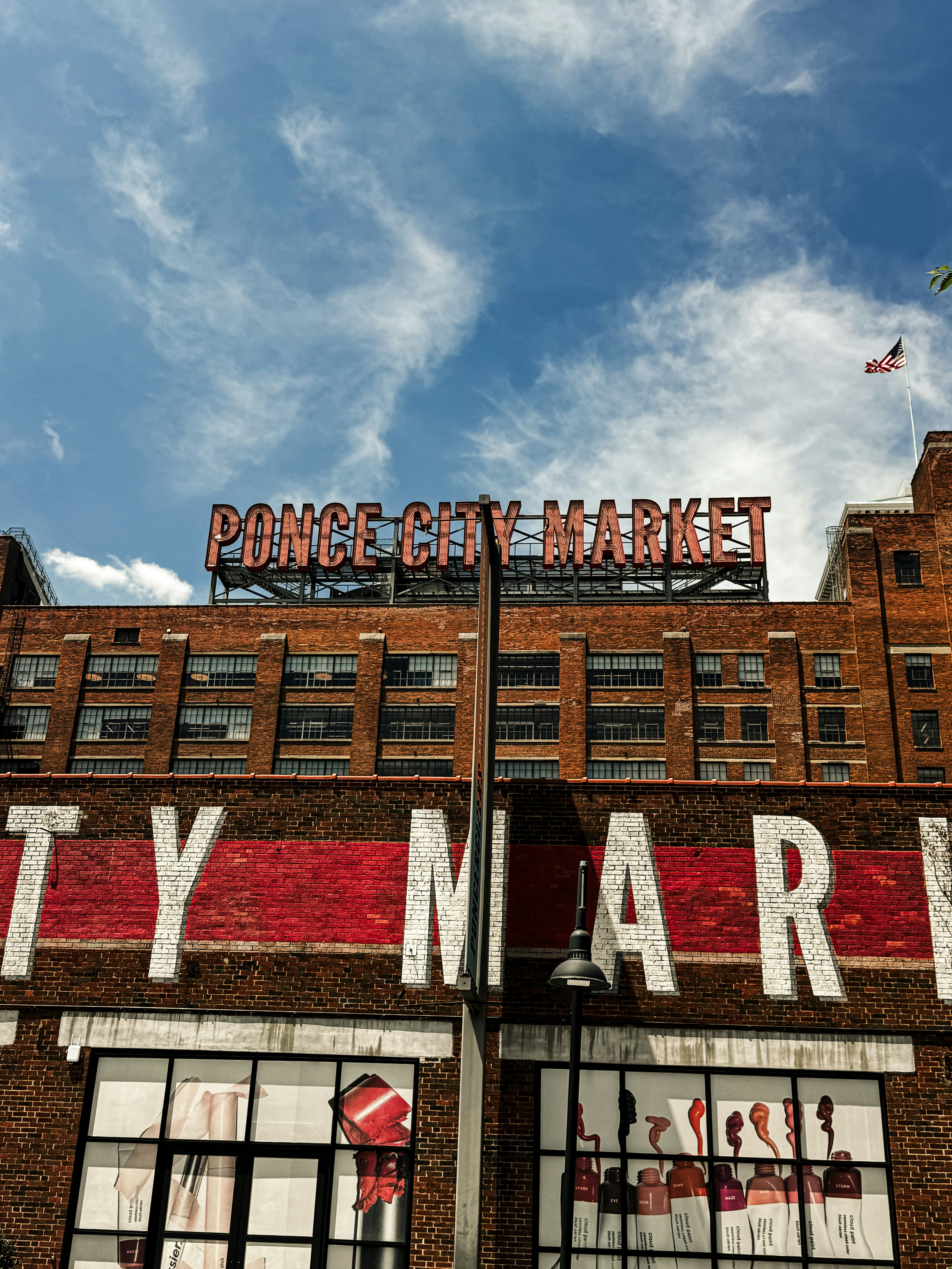 Ponge City Market Sign Rooftop Over Brick Warehouse Facade