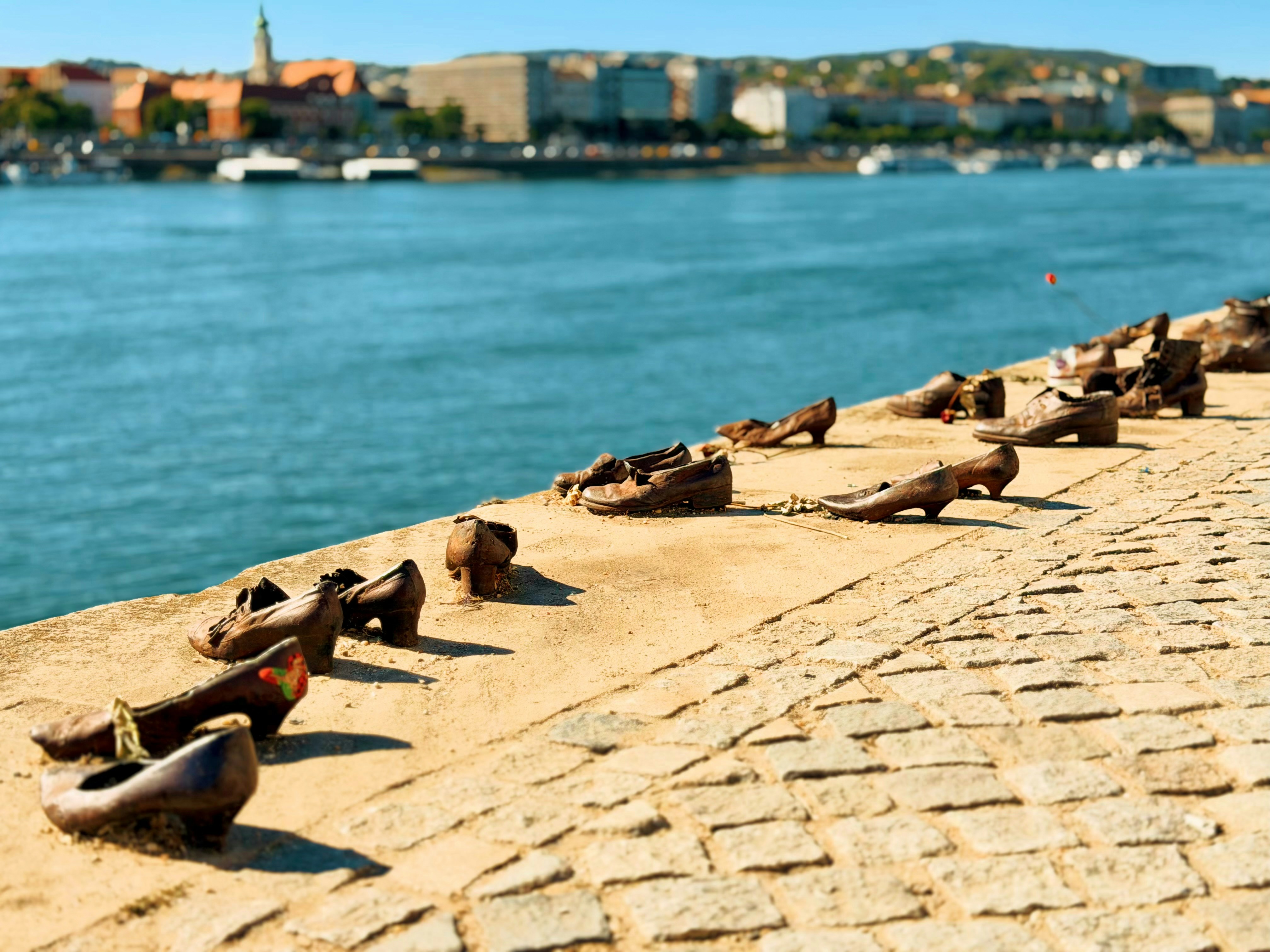 Shoes in a Quiet Waterfront: A Cobblestone Dock Pathways