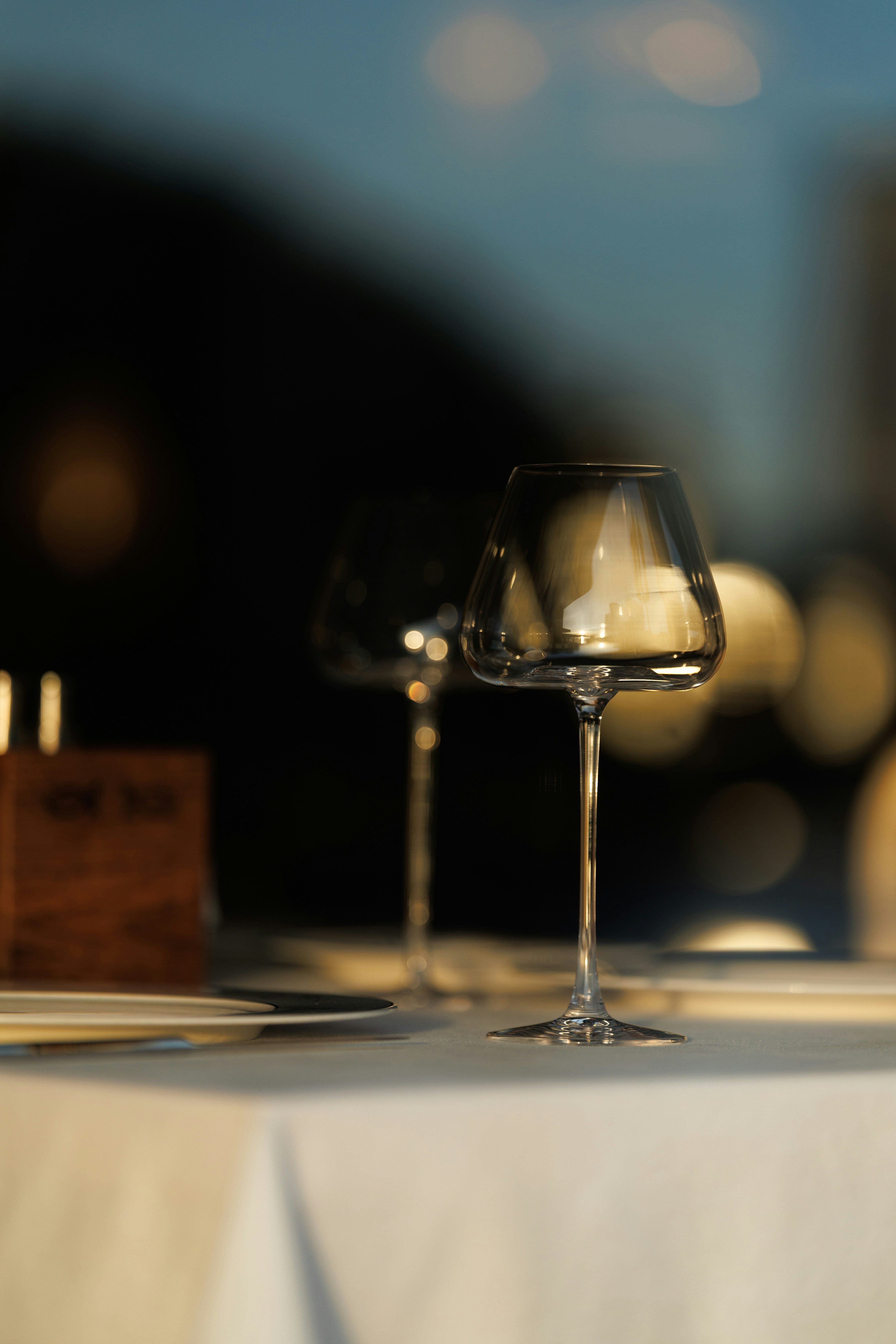 Wine Glass in Soft Spotlight: Quiet Table at Dusk
