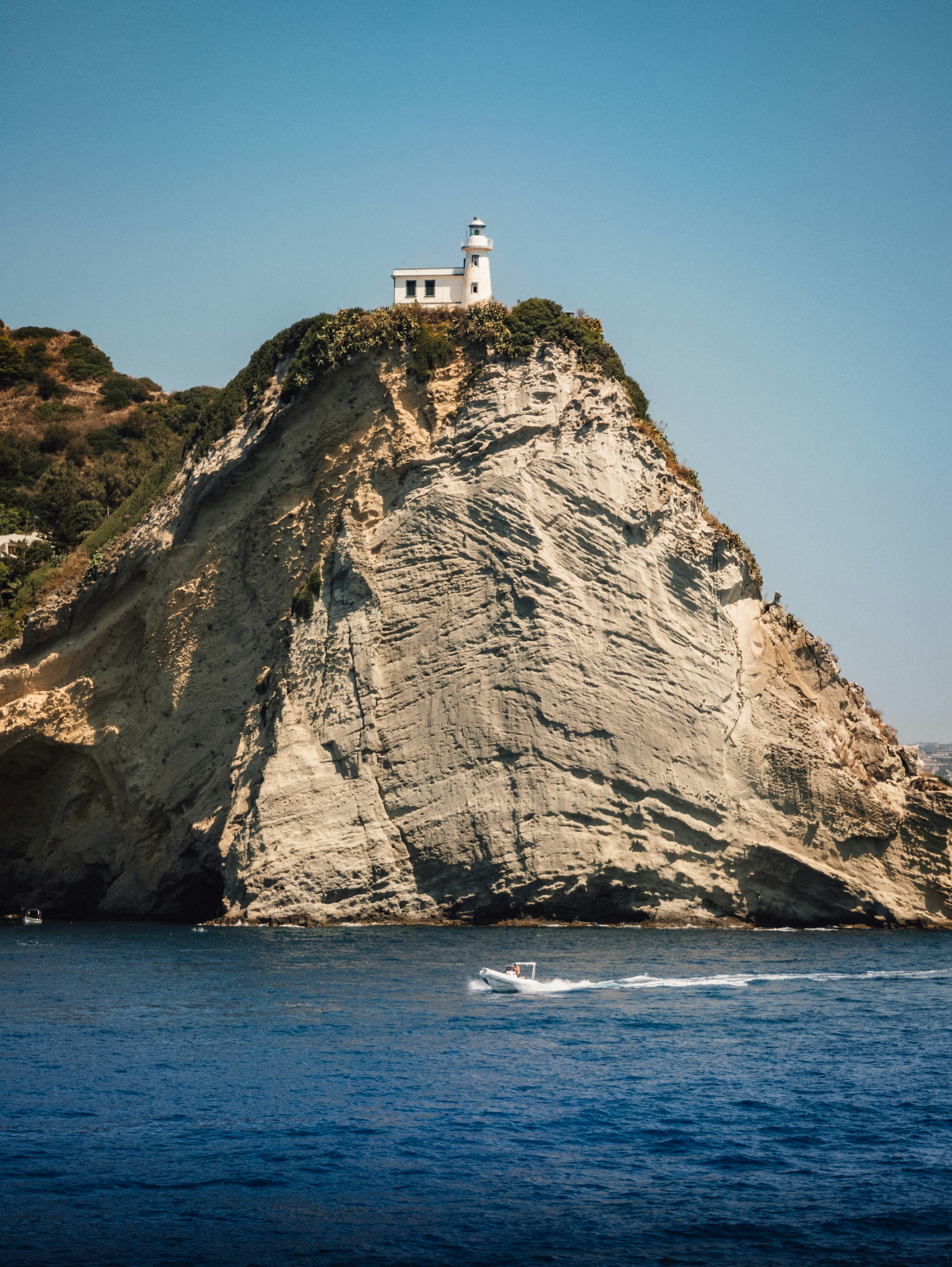 Lighthouse Crown: A Clifftop Beacon Over Sea Blue