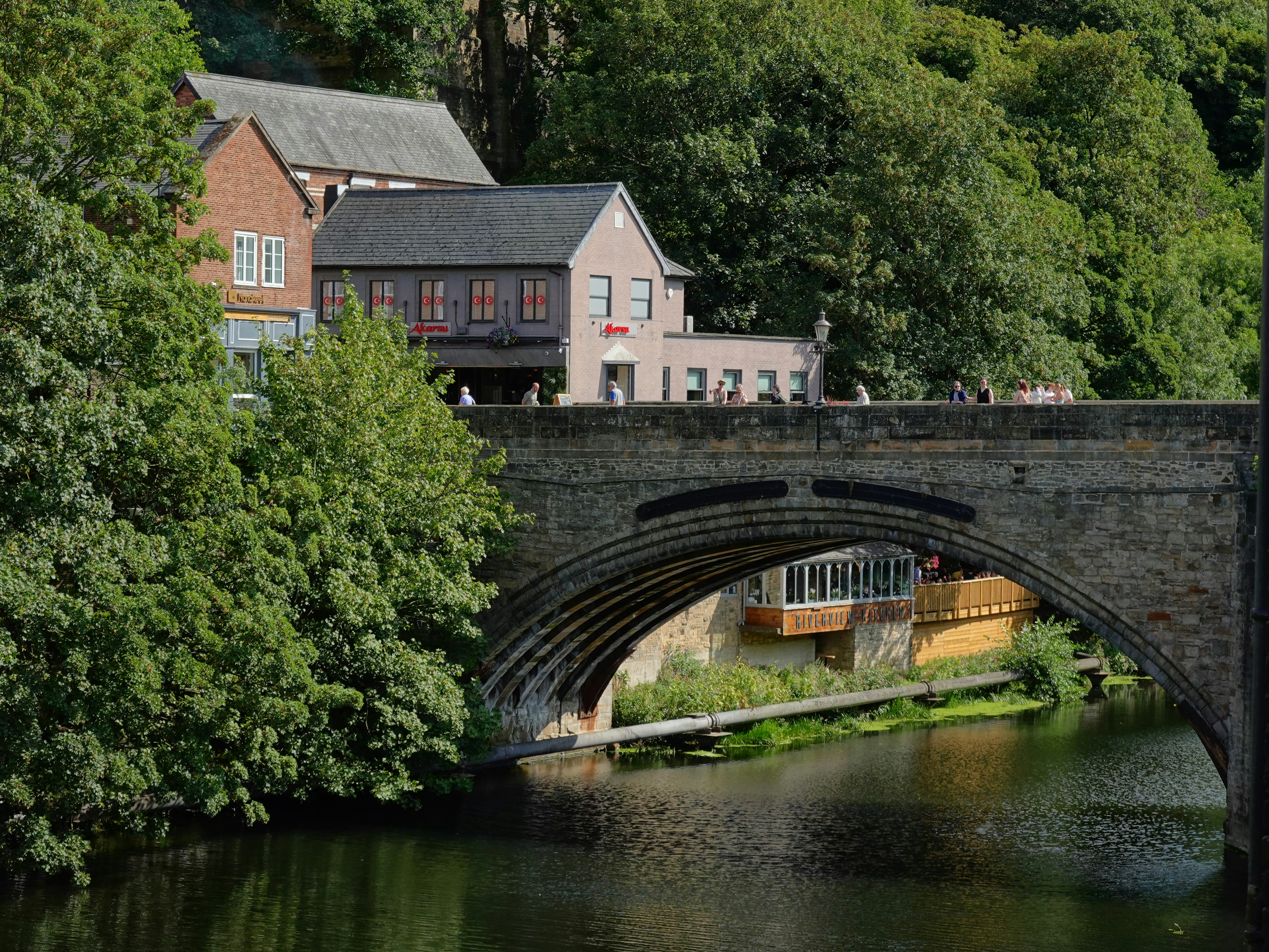 Stone Arch Over River: A Quiet Town by the Bridge