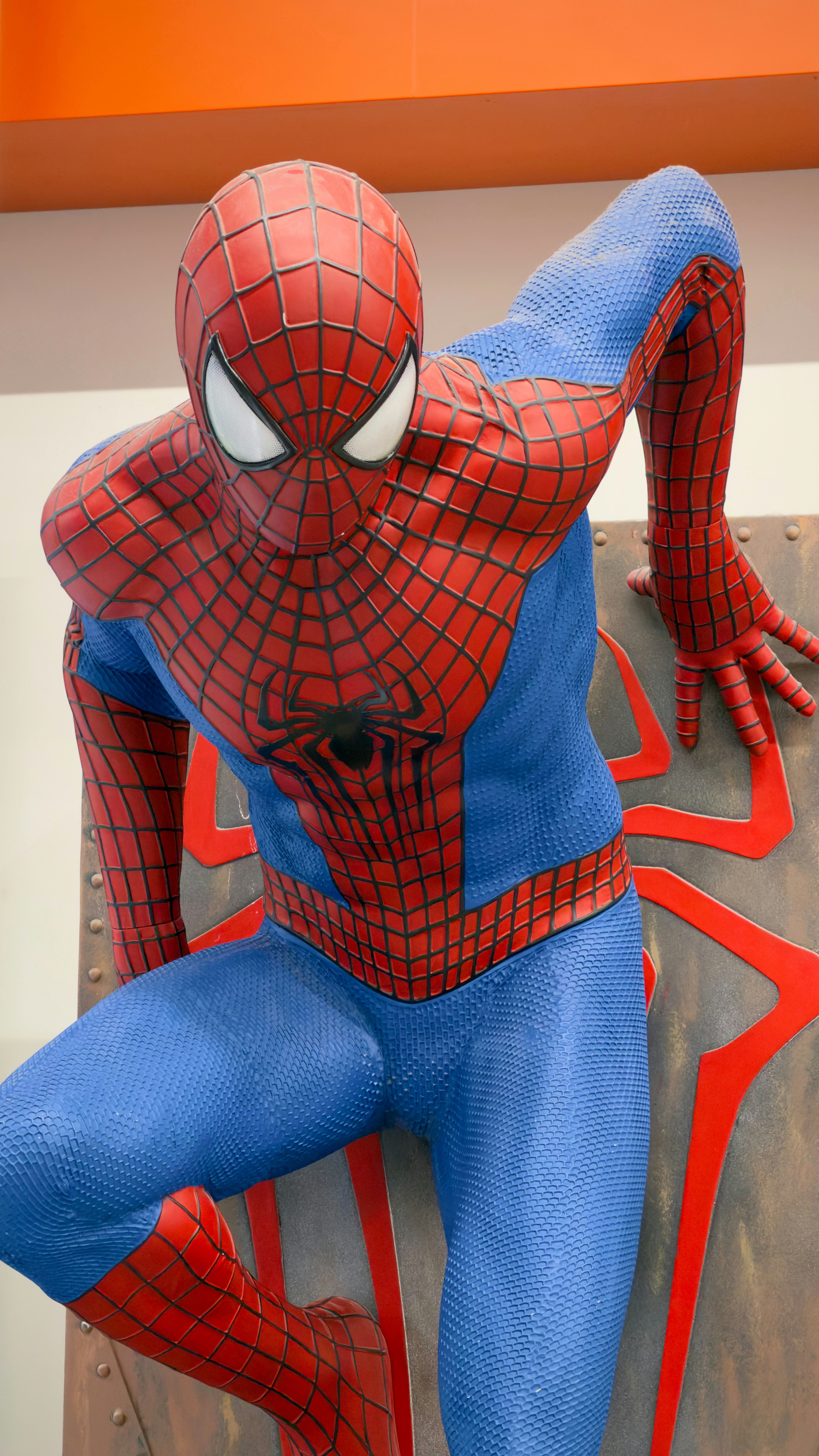Spider-Man Clambering Over a Tech-drenched Display