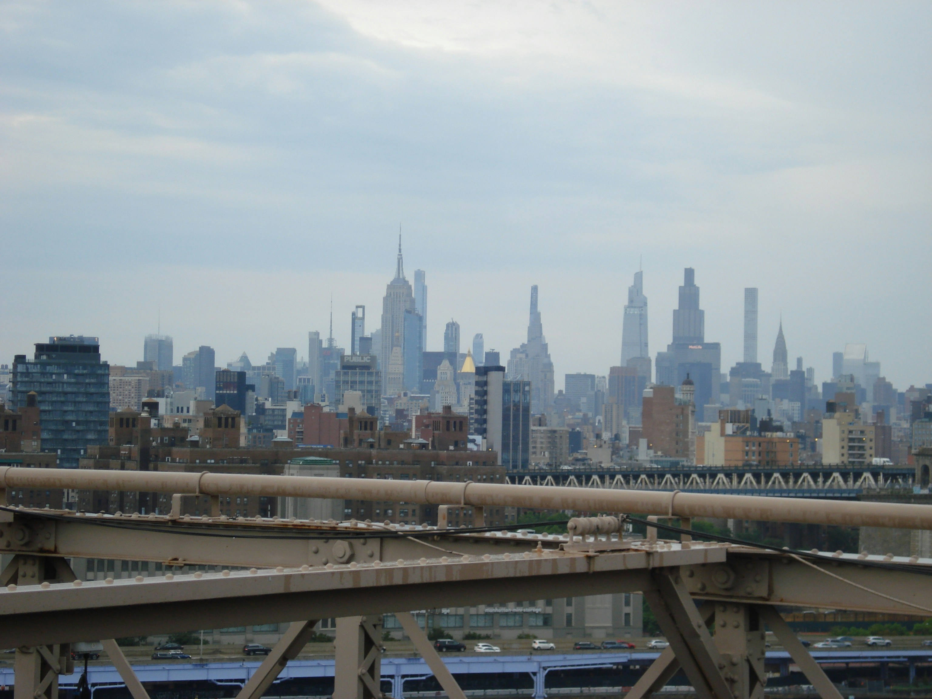 Rooftop Girders with Manhattan Skyline Beyond