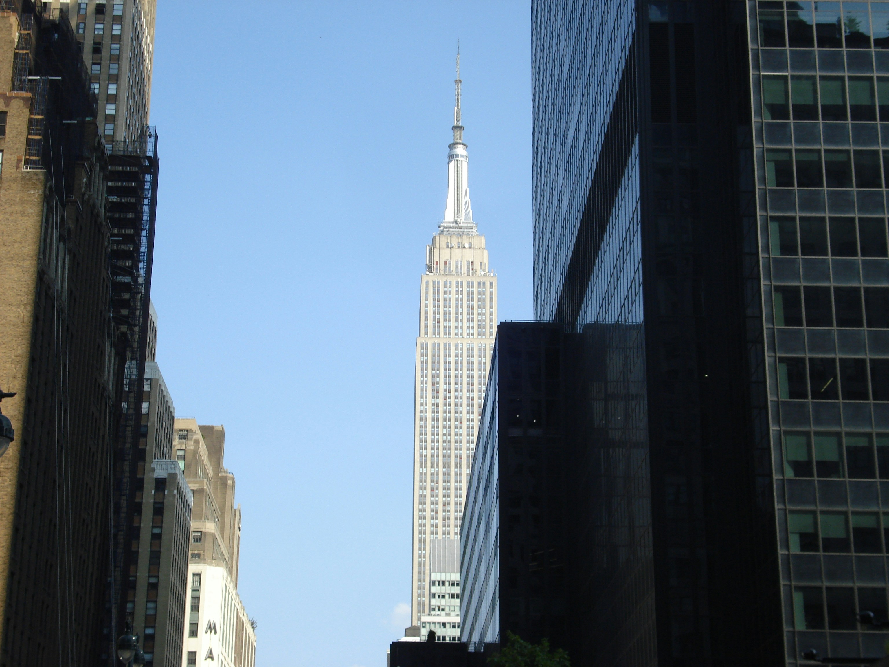 Skyward Needle: Empire State Against a Clear Blue Gable
