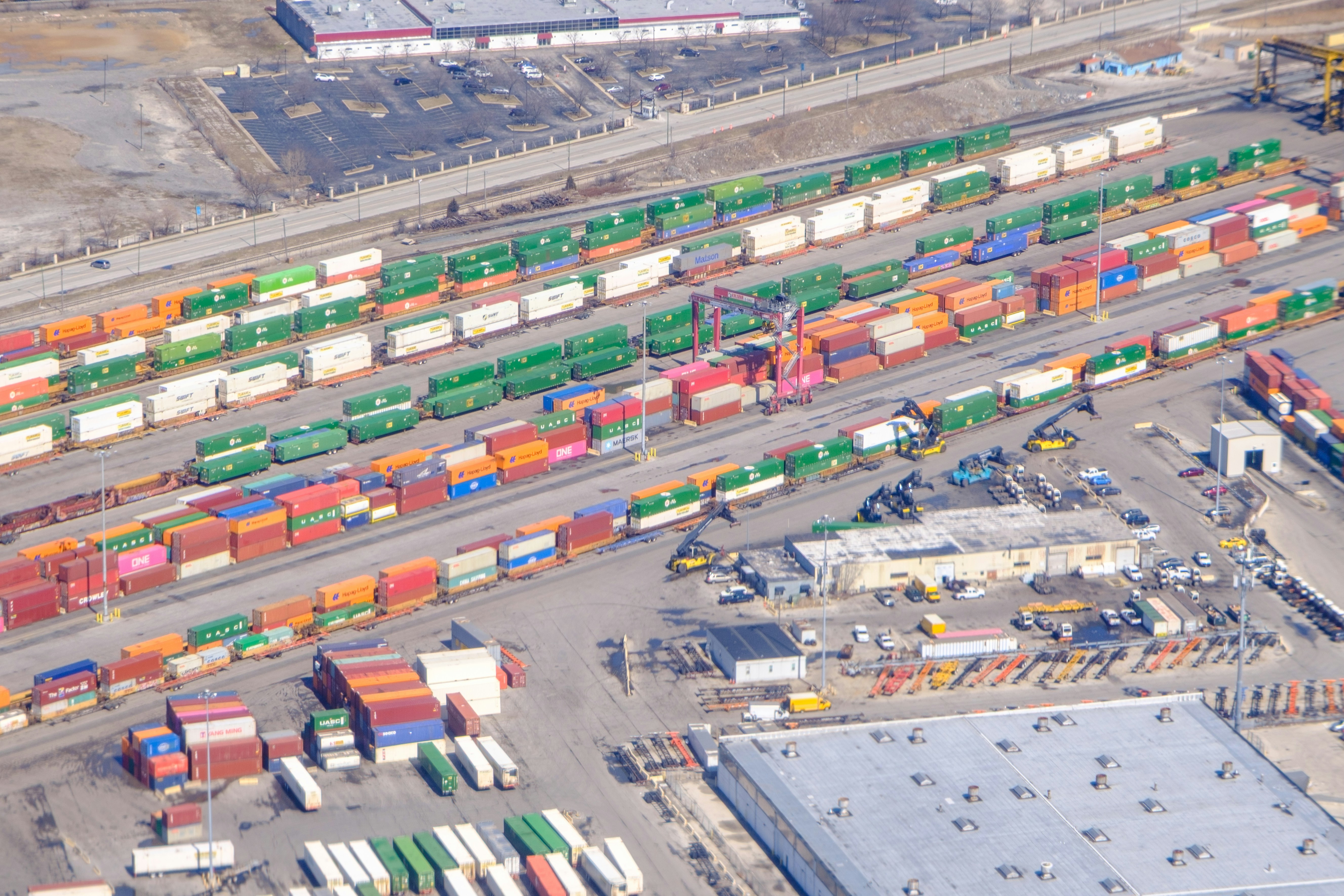 Colorful Container Rows: An Aerial Snapshot of a Busy Freight Yard