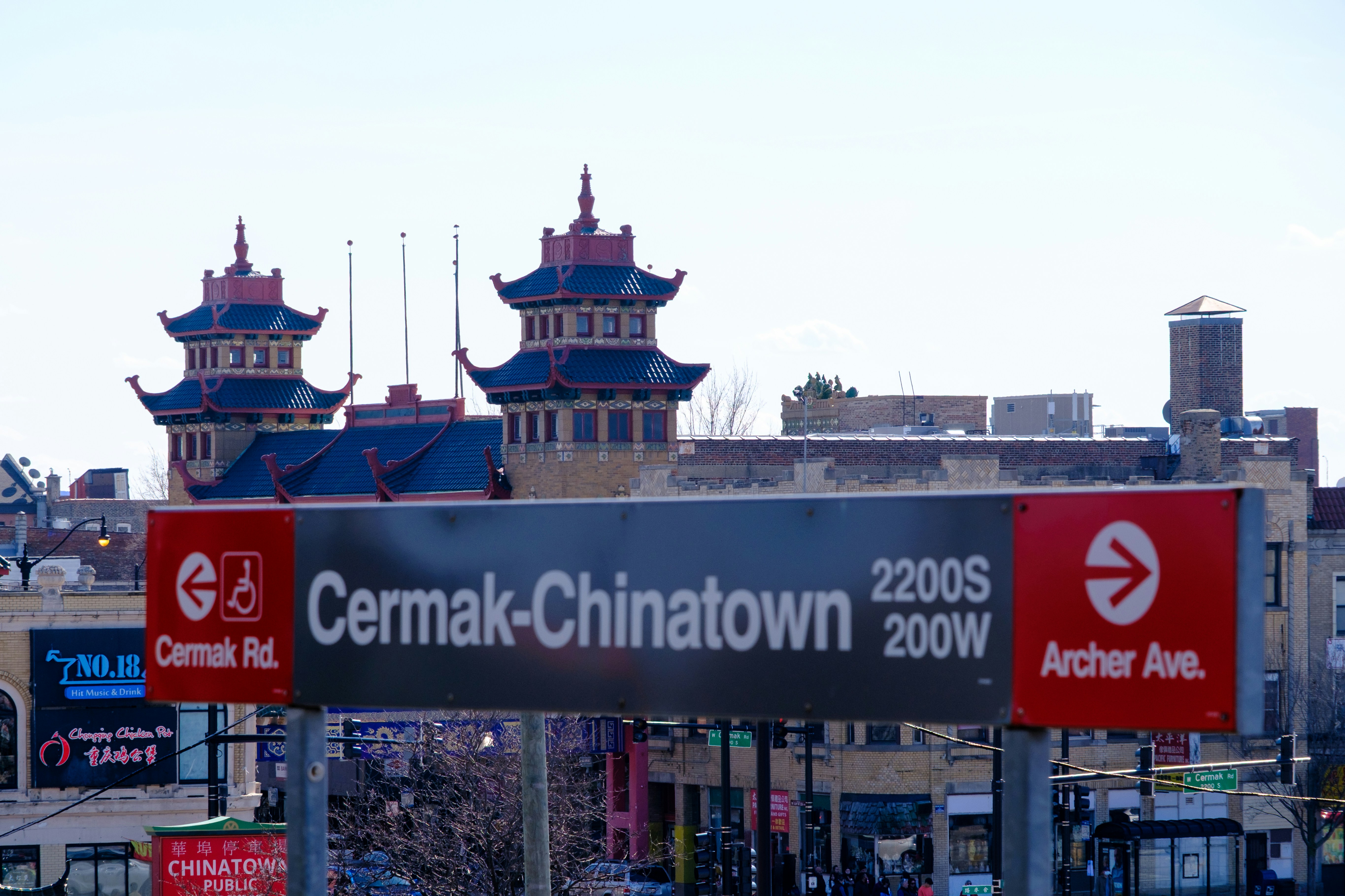 Gateway to Chinatown: Signage and Pagoda Silhouettes Over the Street