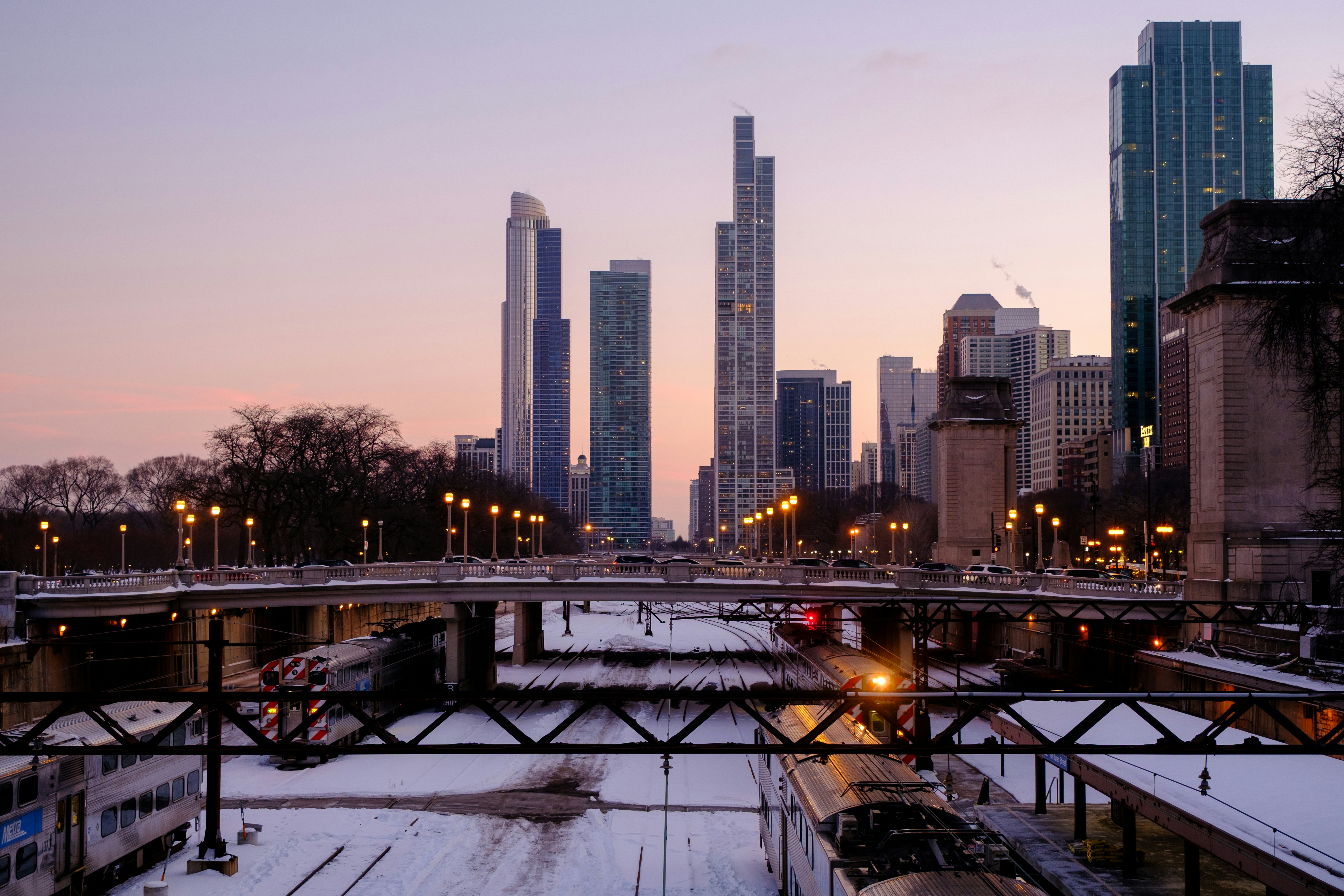Dusk Over the River Arc: Neon Skyline Rising Beyond Snow