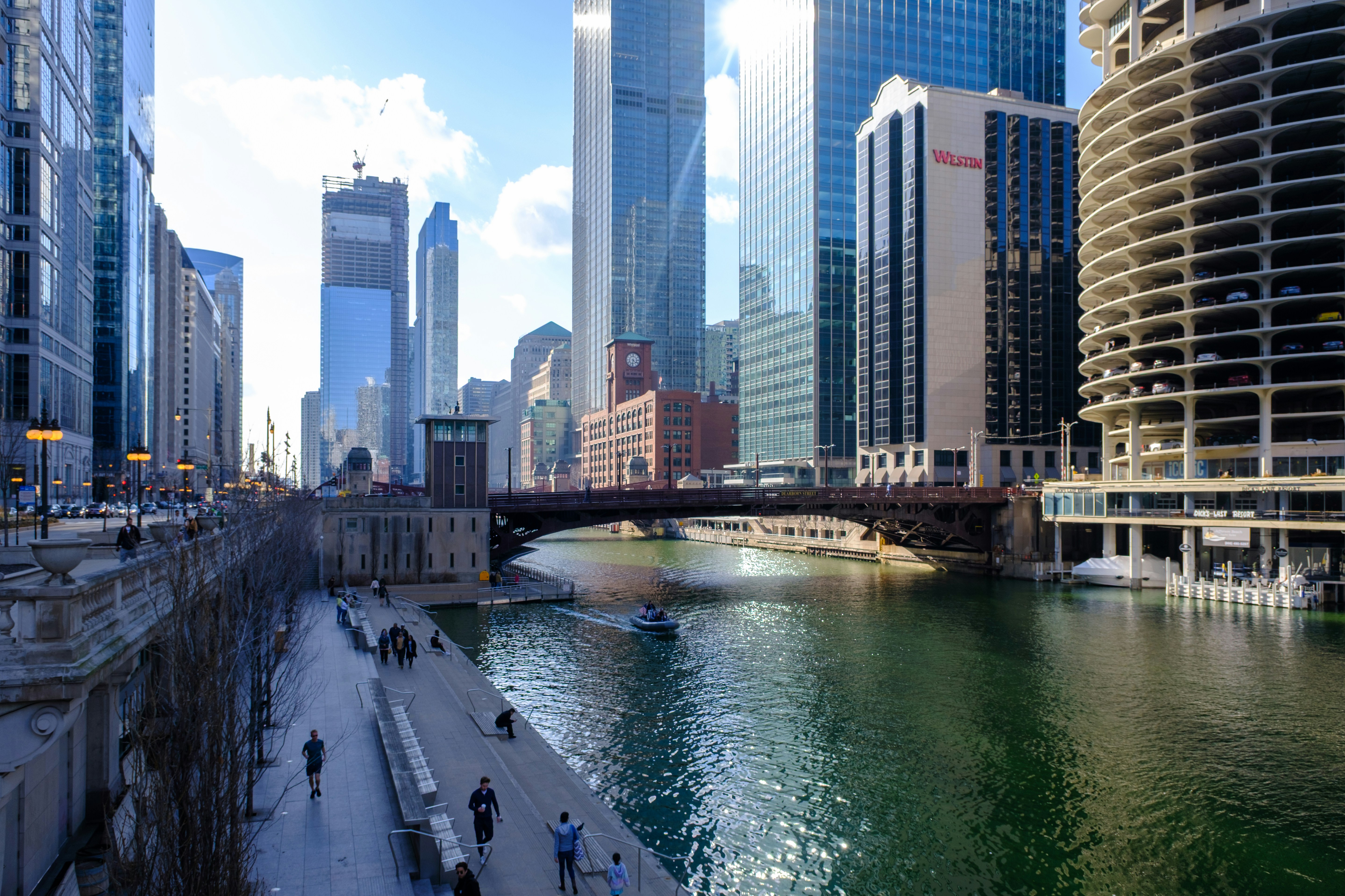 Vertical Cityscape Over the River: A Walk Beneath Glass and Steel