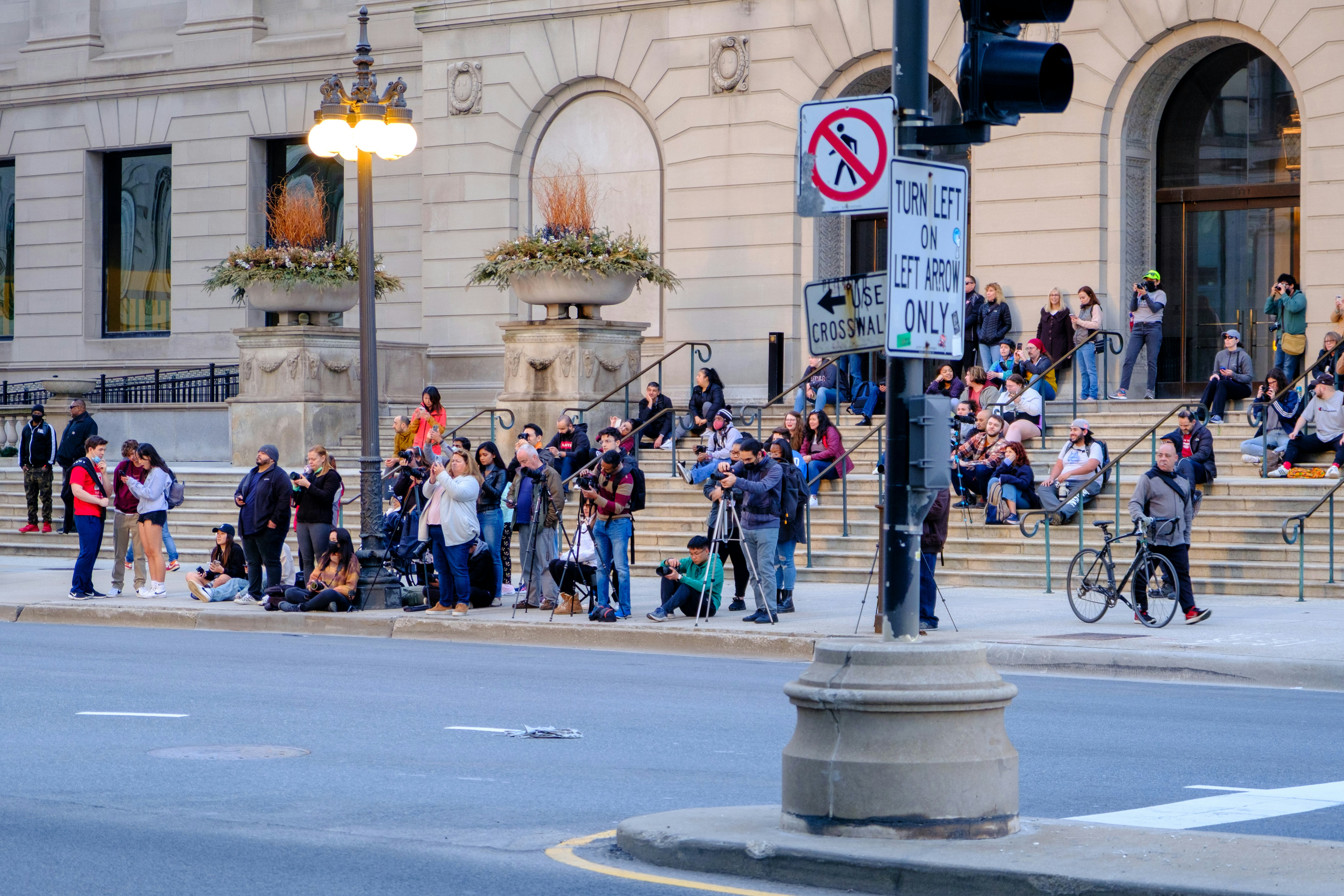 Crowd of Onlookers gathered along a grand stair at a city landmark