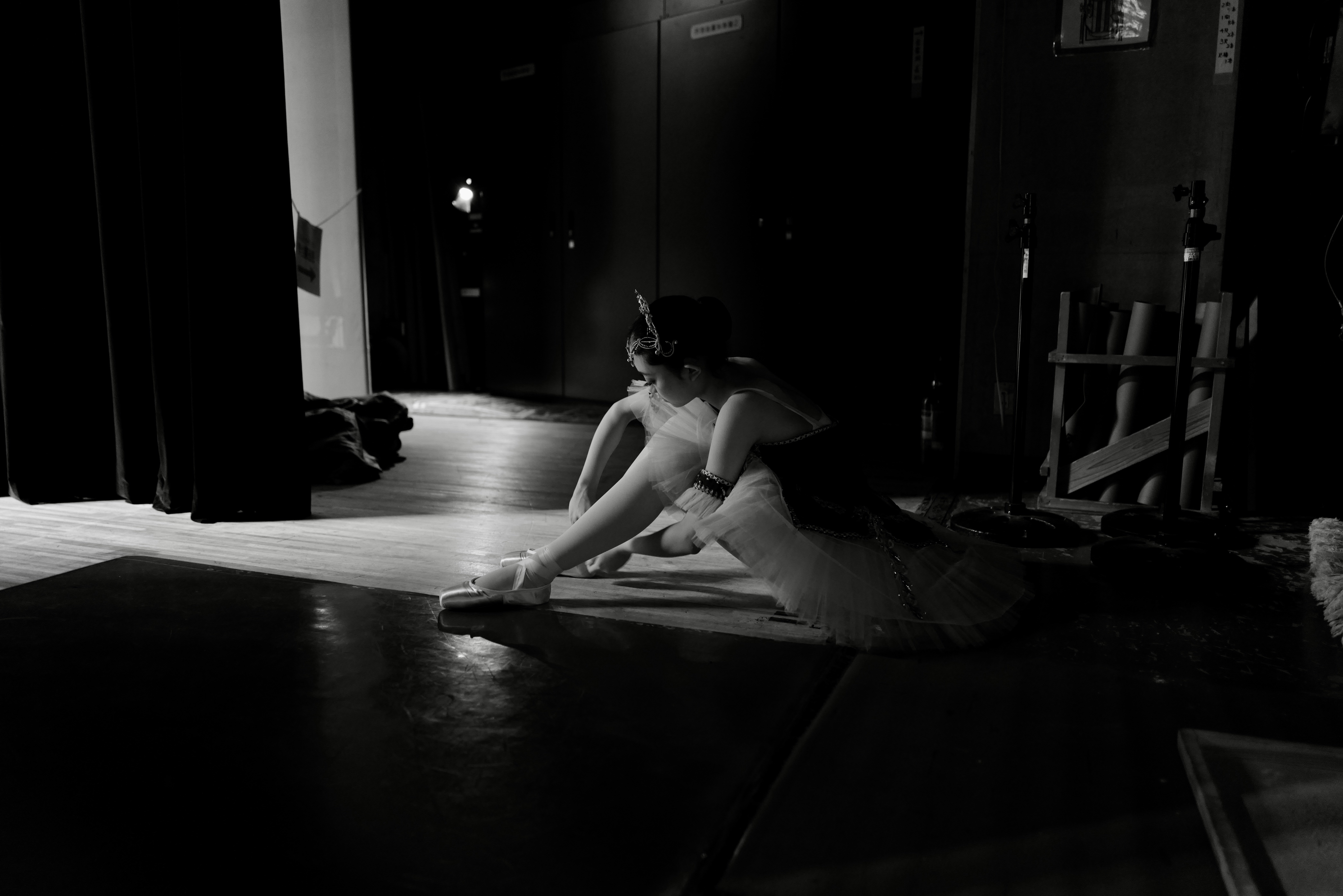 Solo Rehearsal in Low Light: A Balletist in the Wings