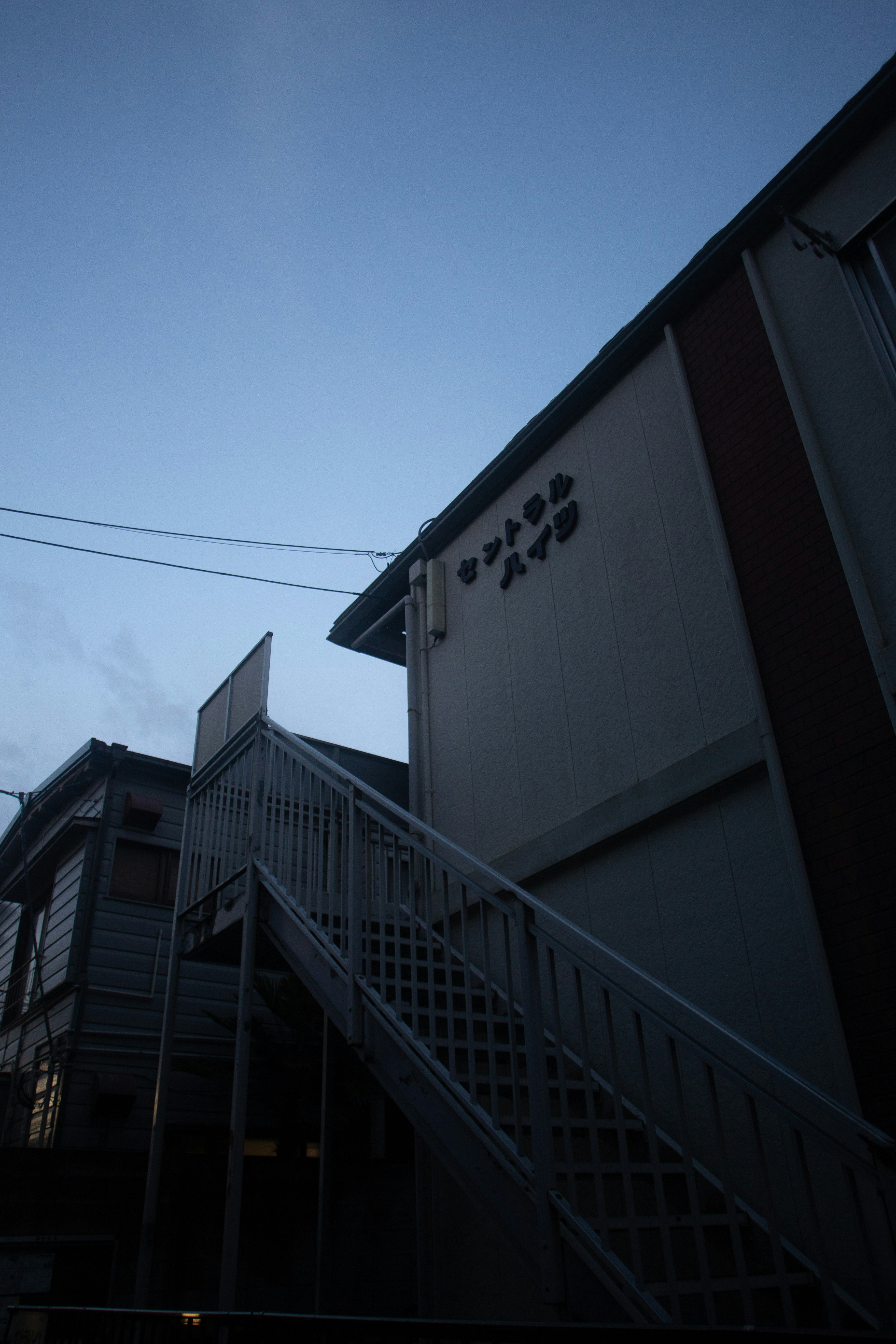 Industrial Staircase Climb Under A Quiet Evening Sky