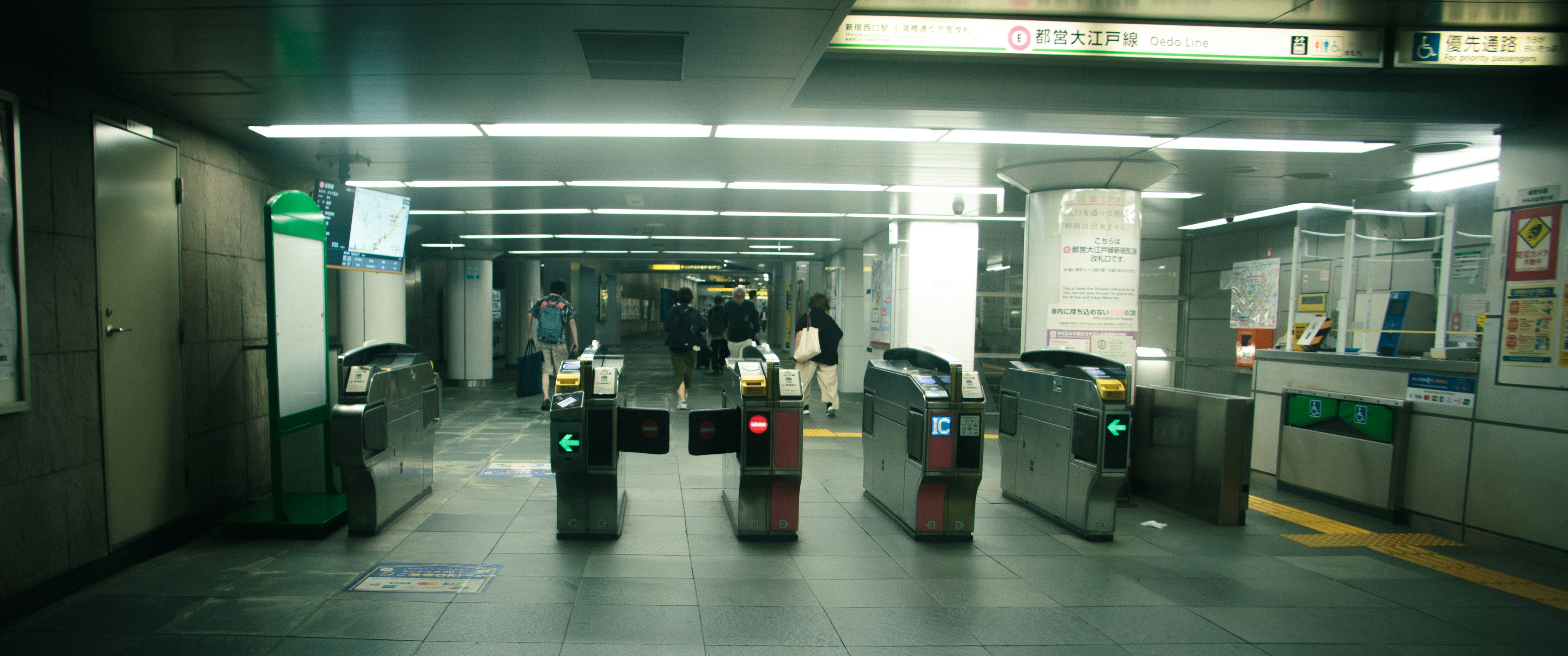 Entrance Gateways: A Quiet Moment Under Fluorescent Streetlight Beams