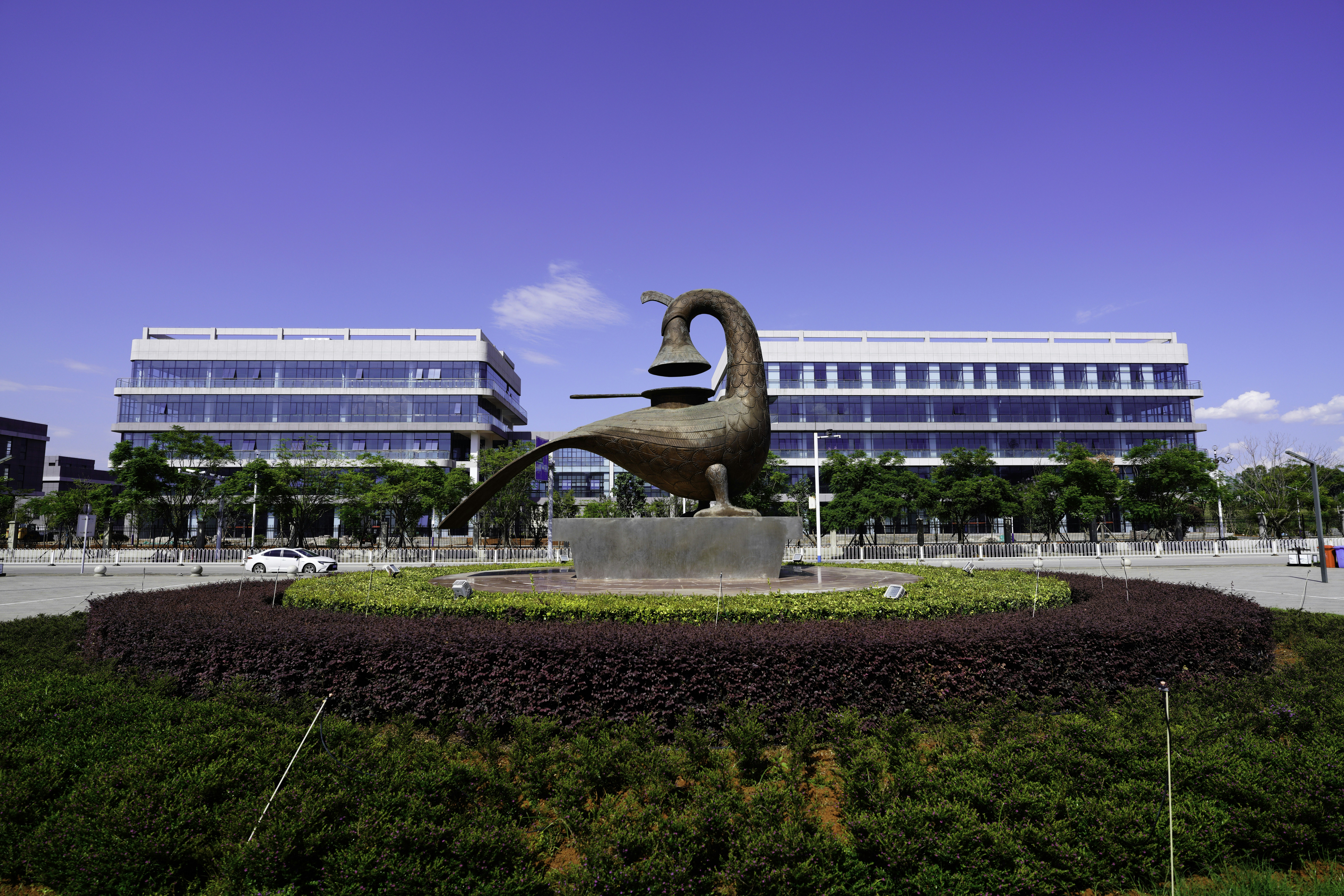 Sculpted Wings Over a Living Garden: A Distant Duck in the City