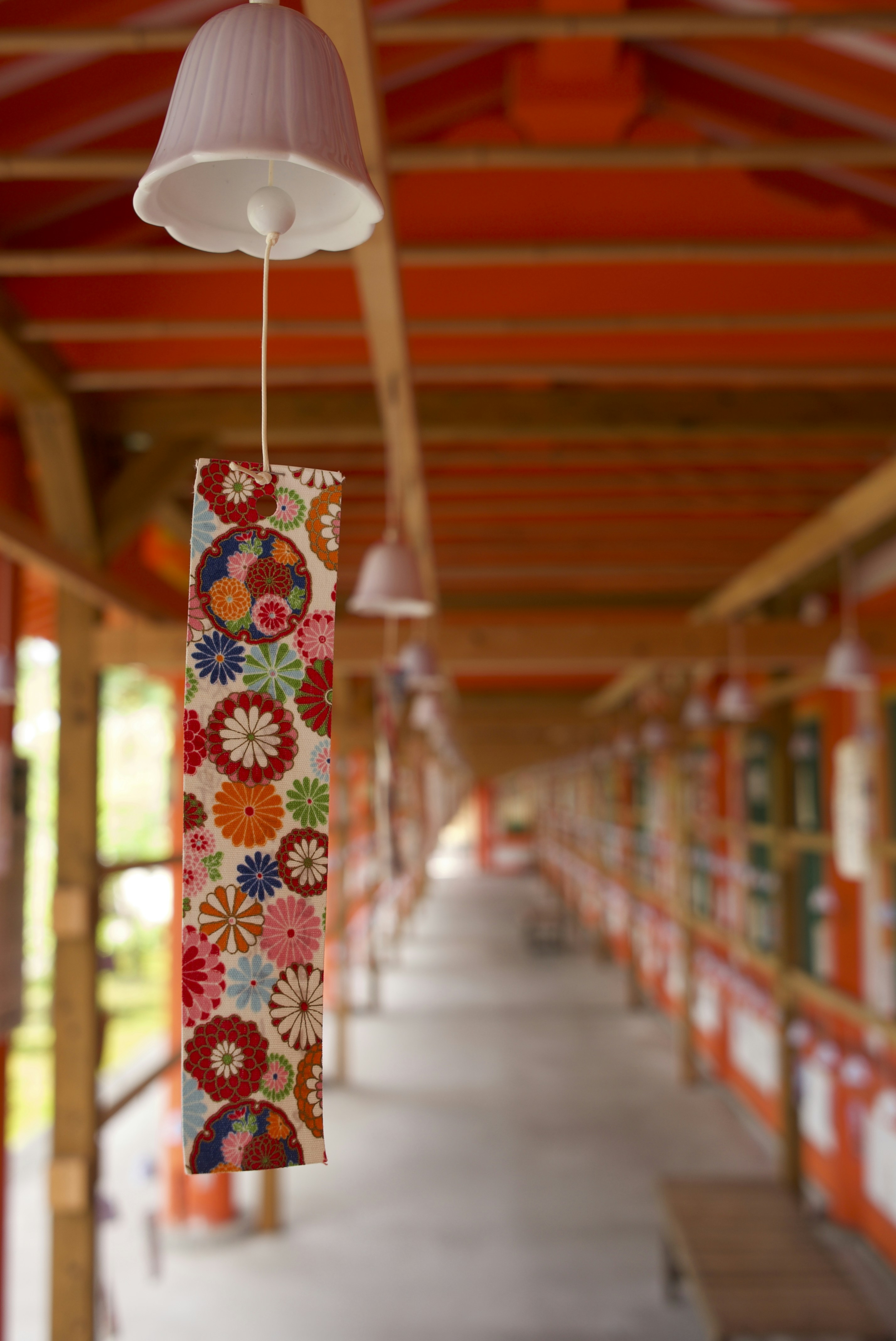 Floating festival ribbon in a sunlit corridor