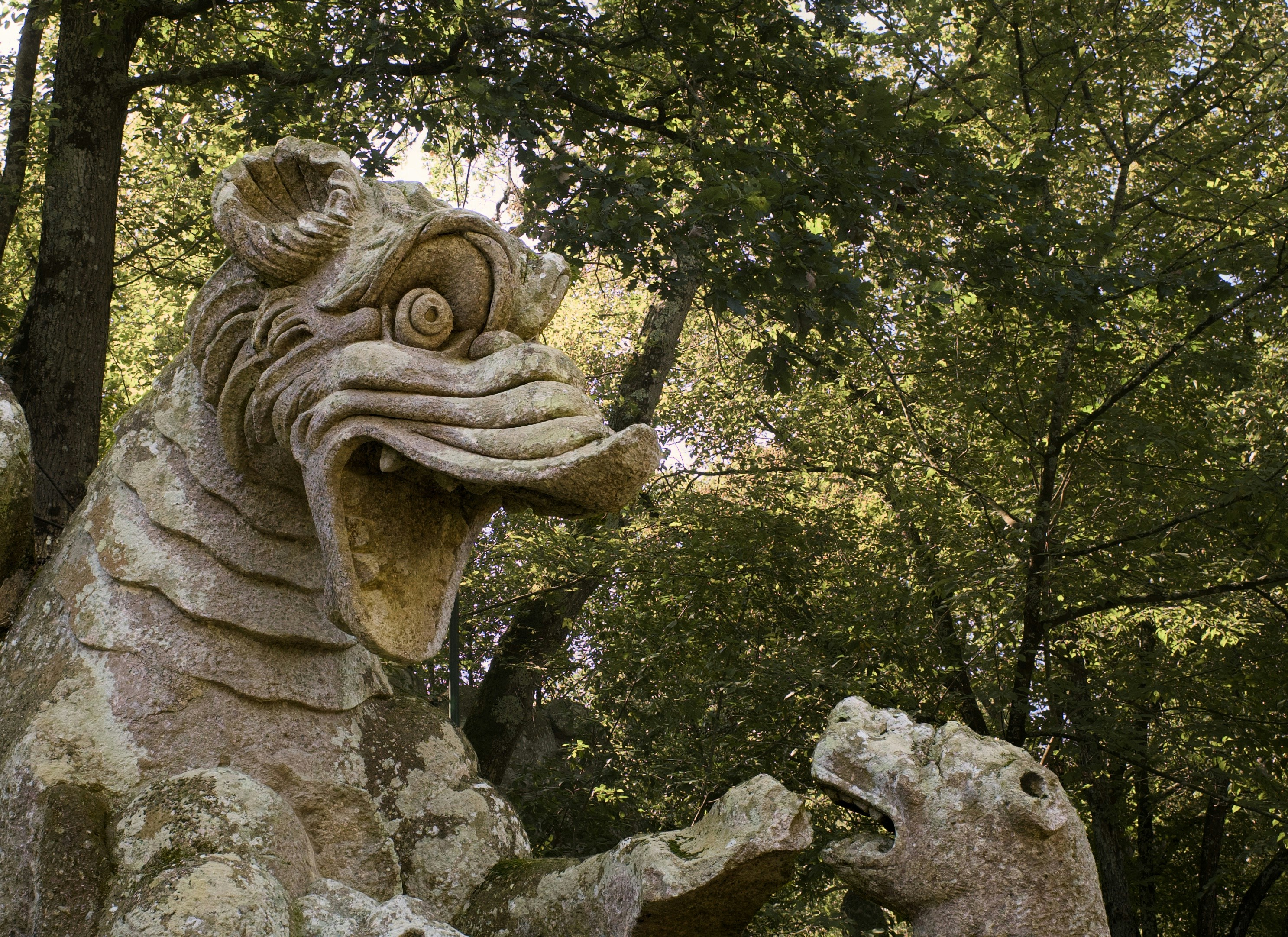 Stone Dragon and Companion in a Sunlit Forest