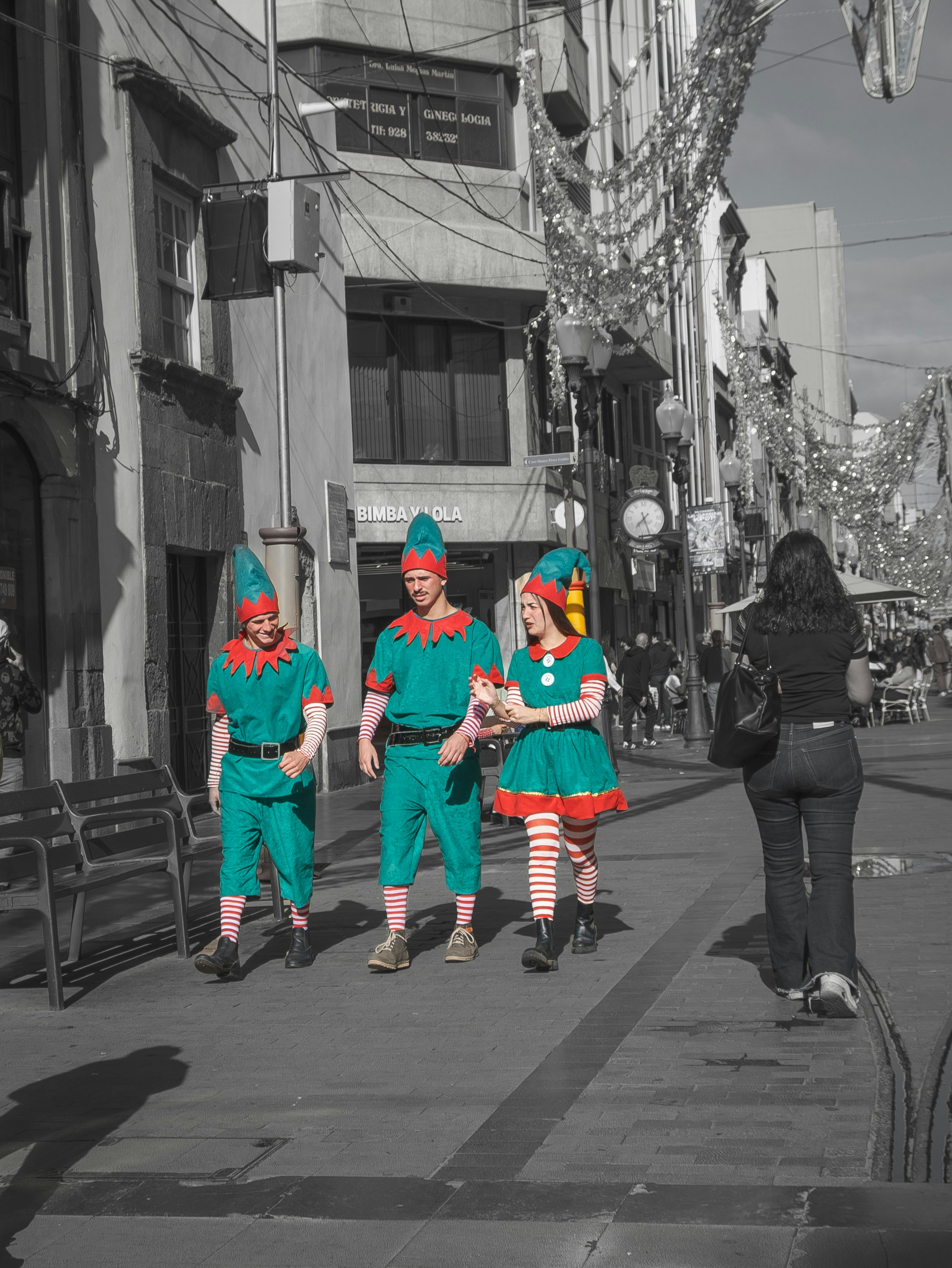 Candy-Coated Parade: Elves Stroll a Sunlit Street