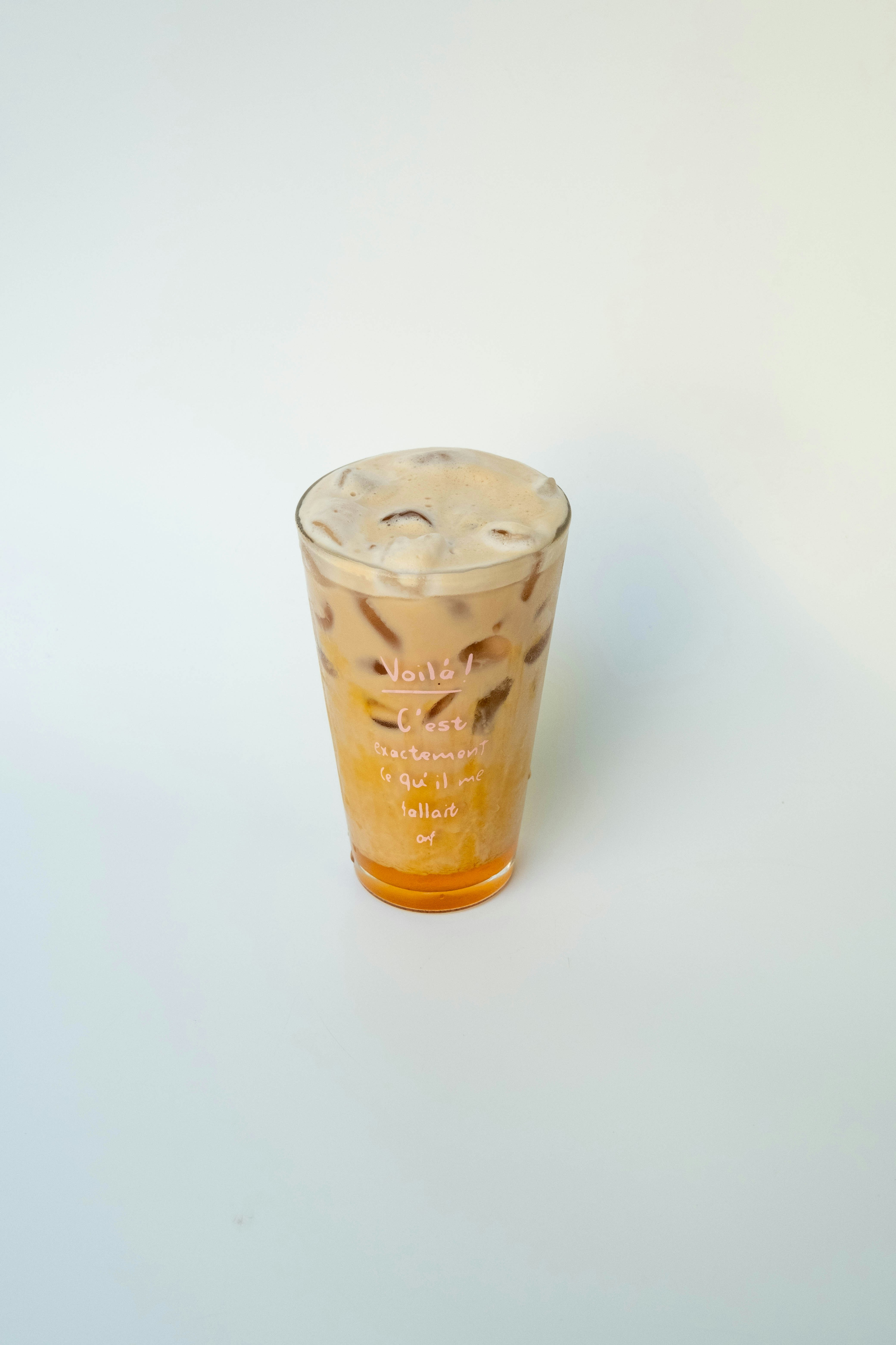 Iced Coffee in Focus: A Minimalist Shot of a Glass on White