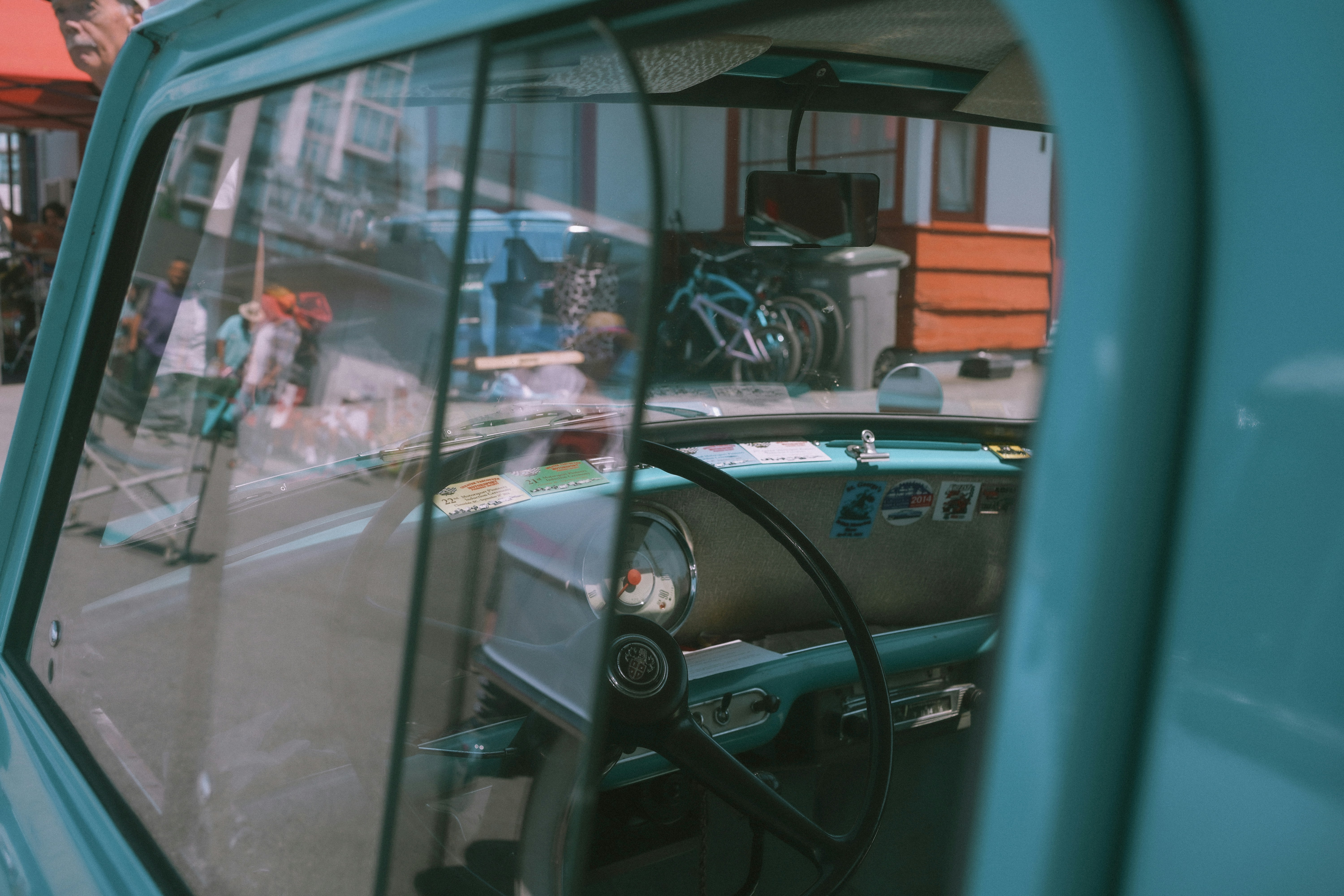 Blue Hued Cab Window: Glimpse into a City Car Interior