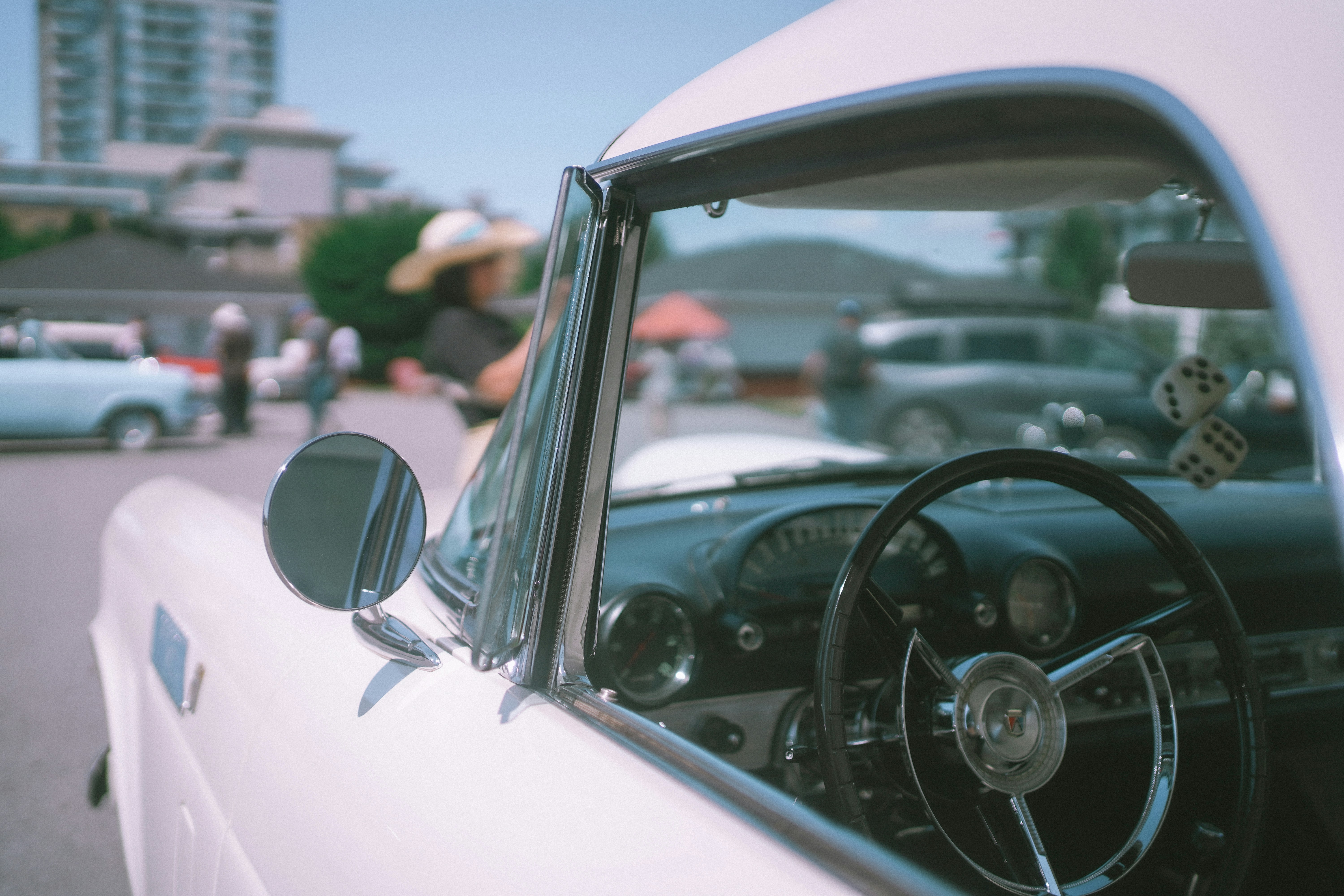 Chrome Steering and Glass: A Glimpse into a Classic Car Interior