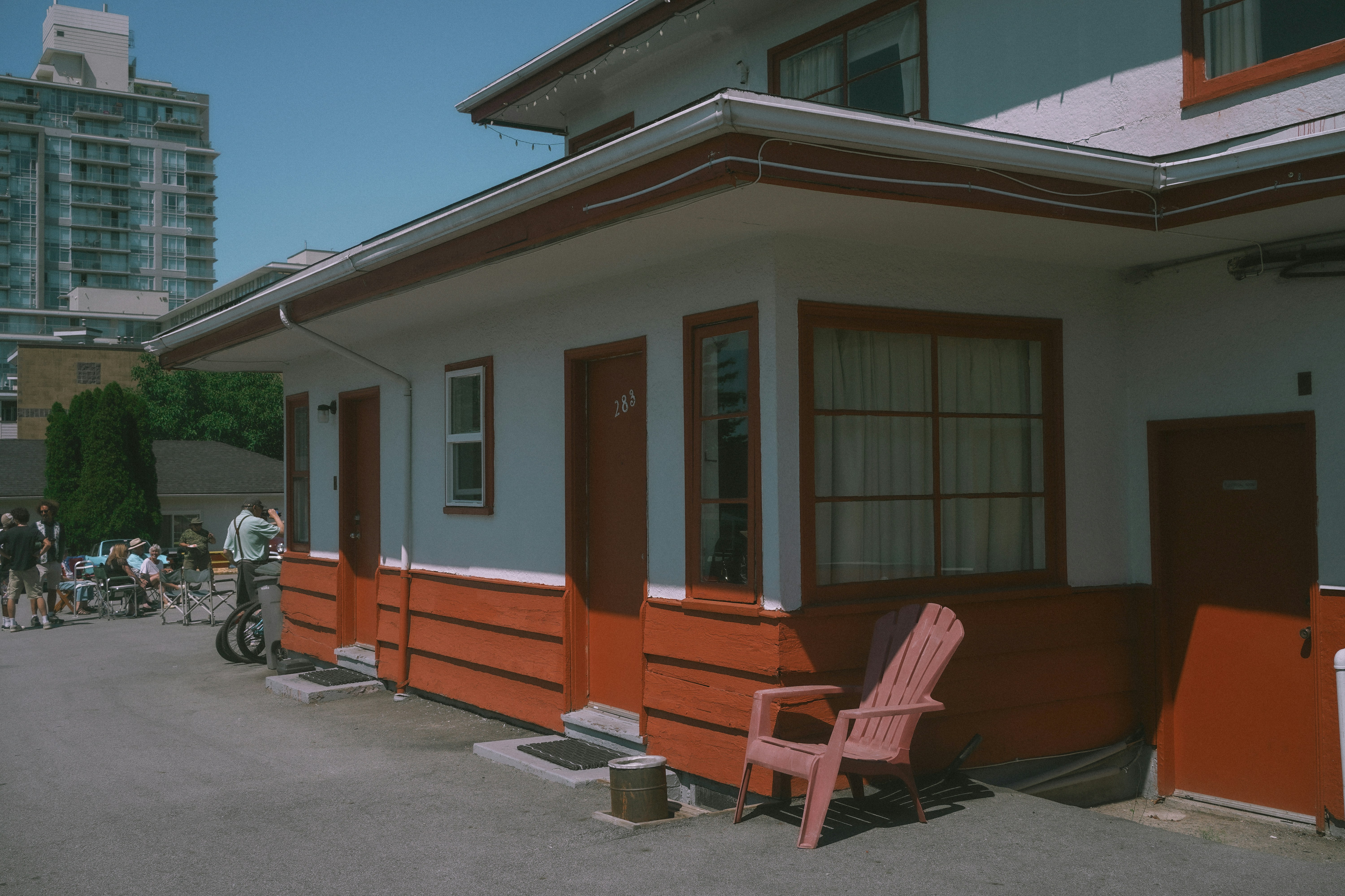 Neon-Quiet Corner: The Red-Walled Shop by the Street