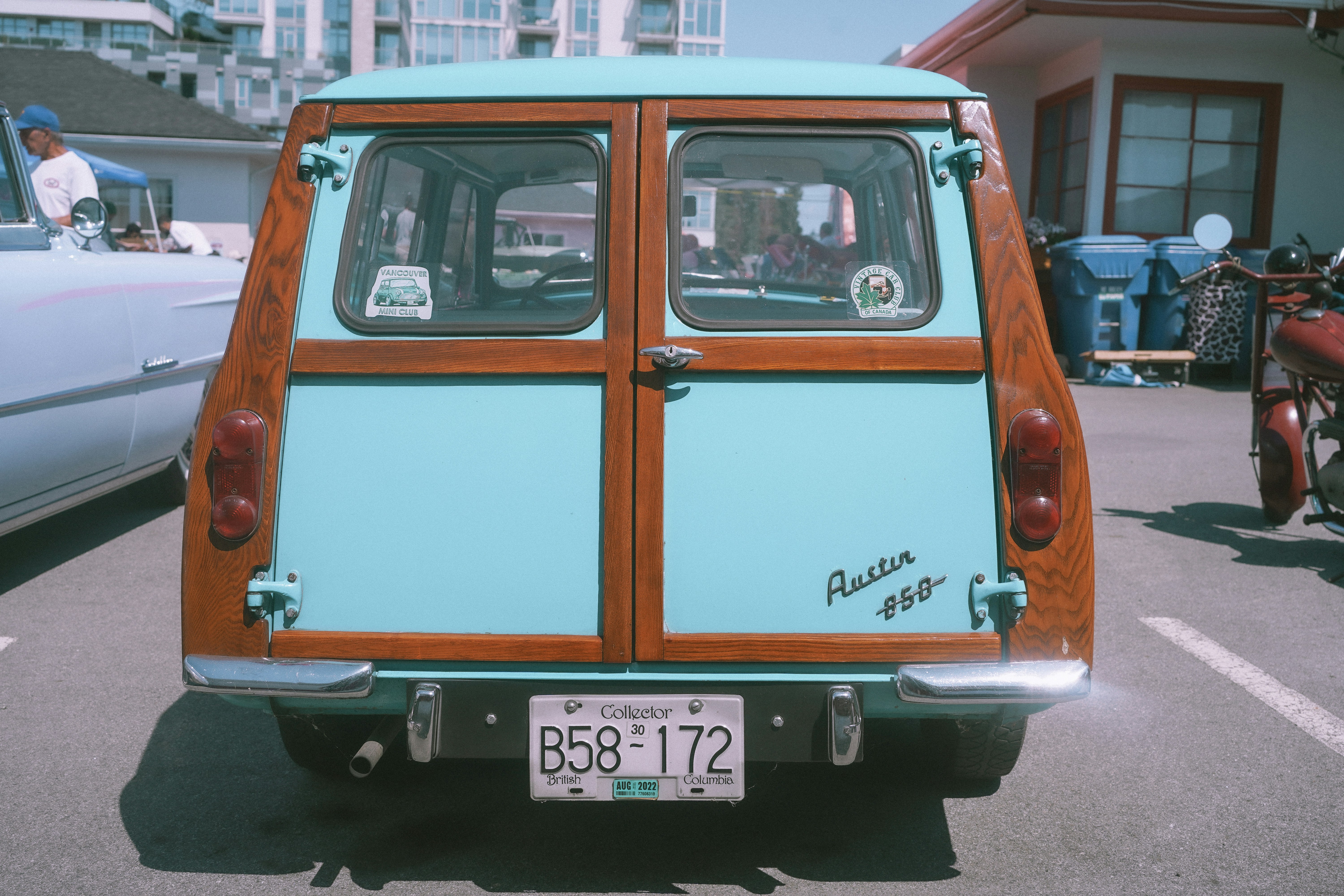 The Wood-and-Blue Hatchback: A Retro Kei Wagon Backlit by Sunlit Parking Lot