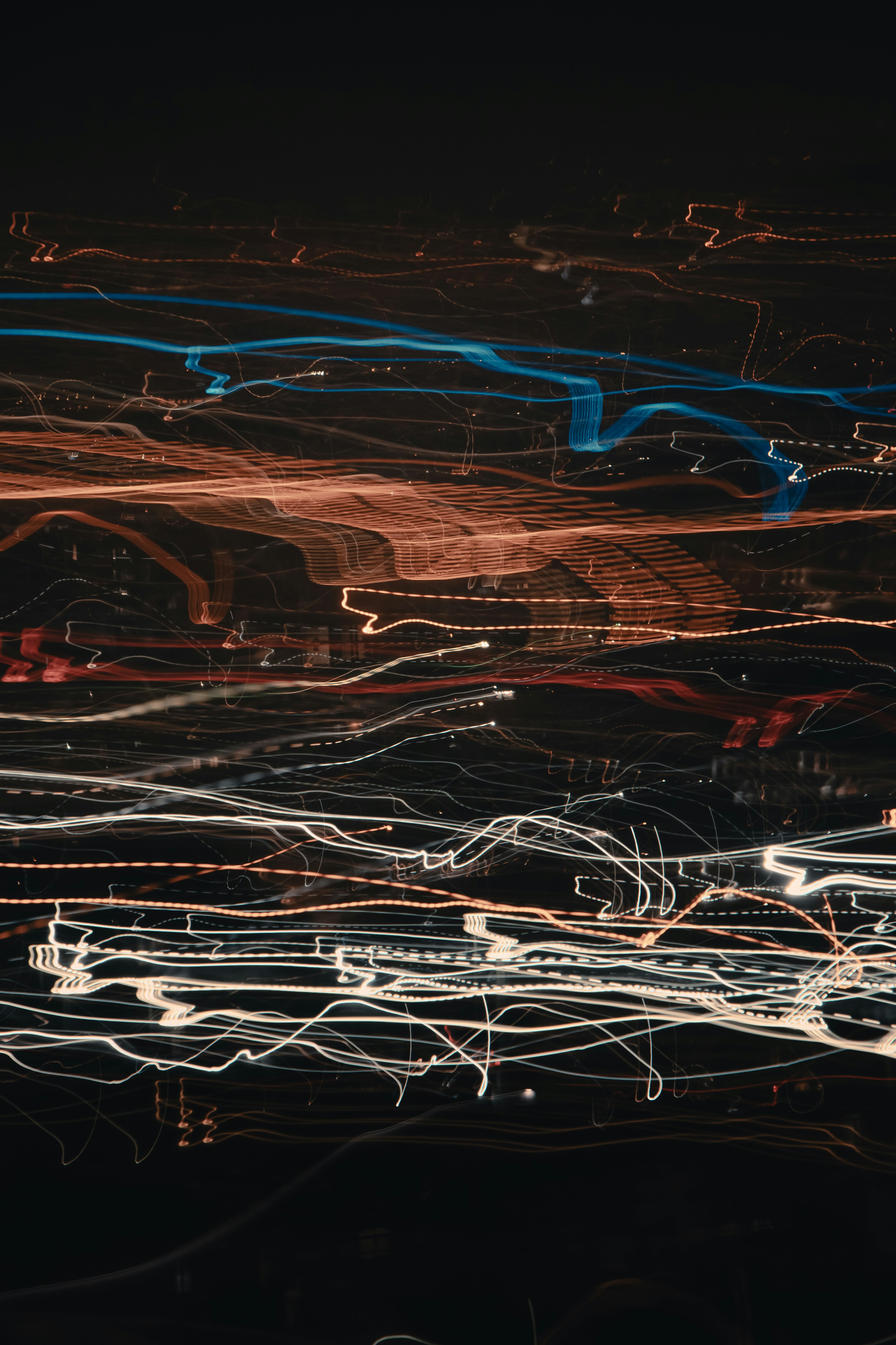 Neon Veil Over City: A Night of Motion Blur and Light Trails