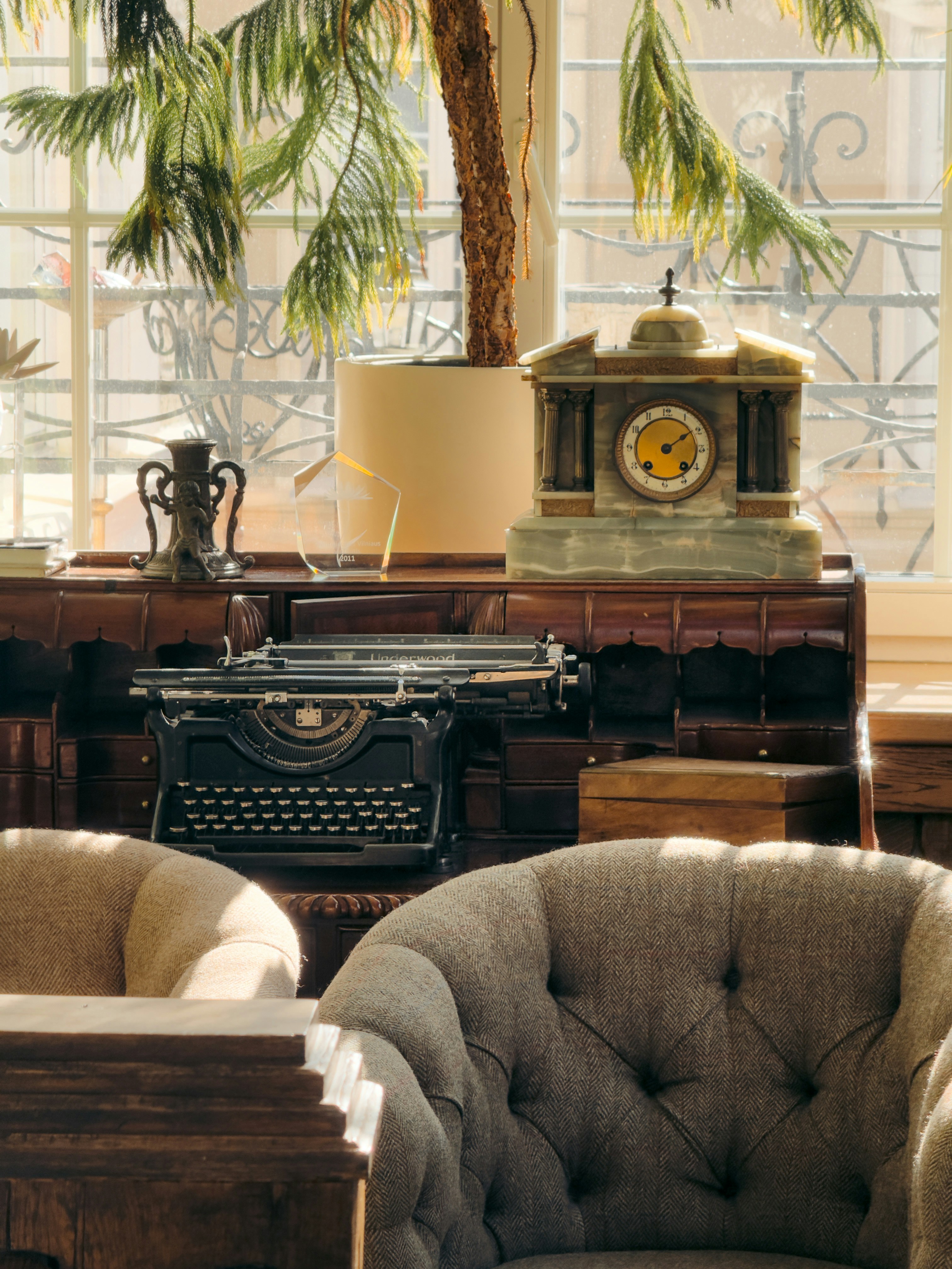 Nostalgia in the Sunlit Parlor: A Vintage Desk Scene