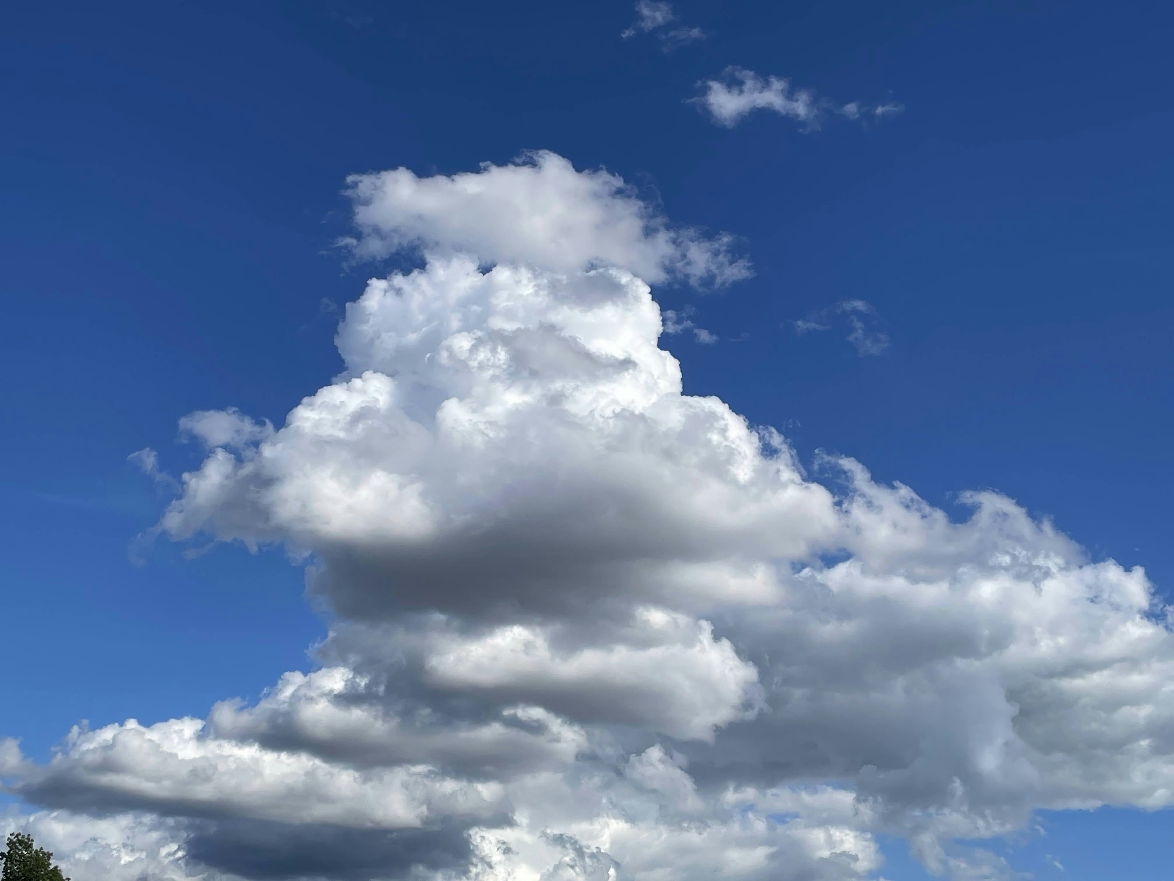 Towering Cloud Cascade Against a Cerulean Sky