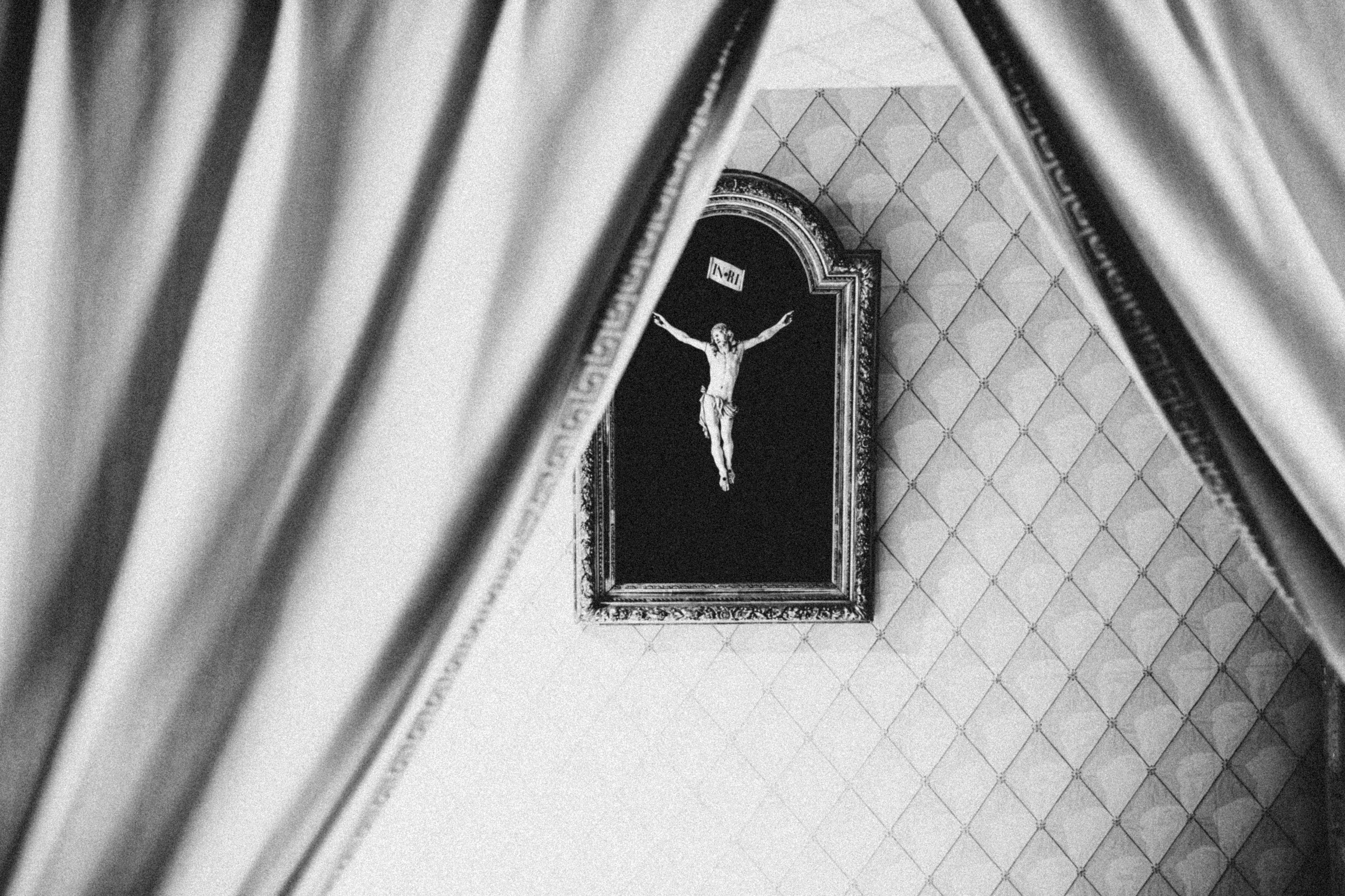 Cruciform Frame Framed by Draped Curtains