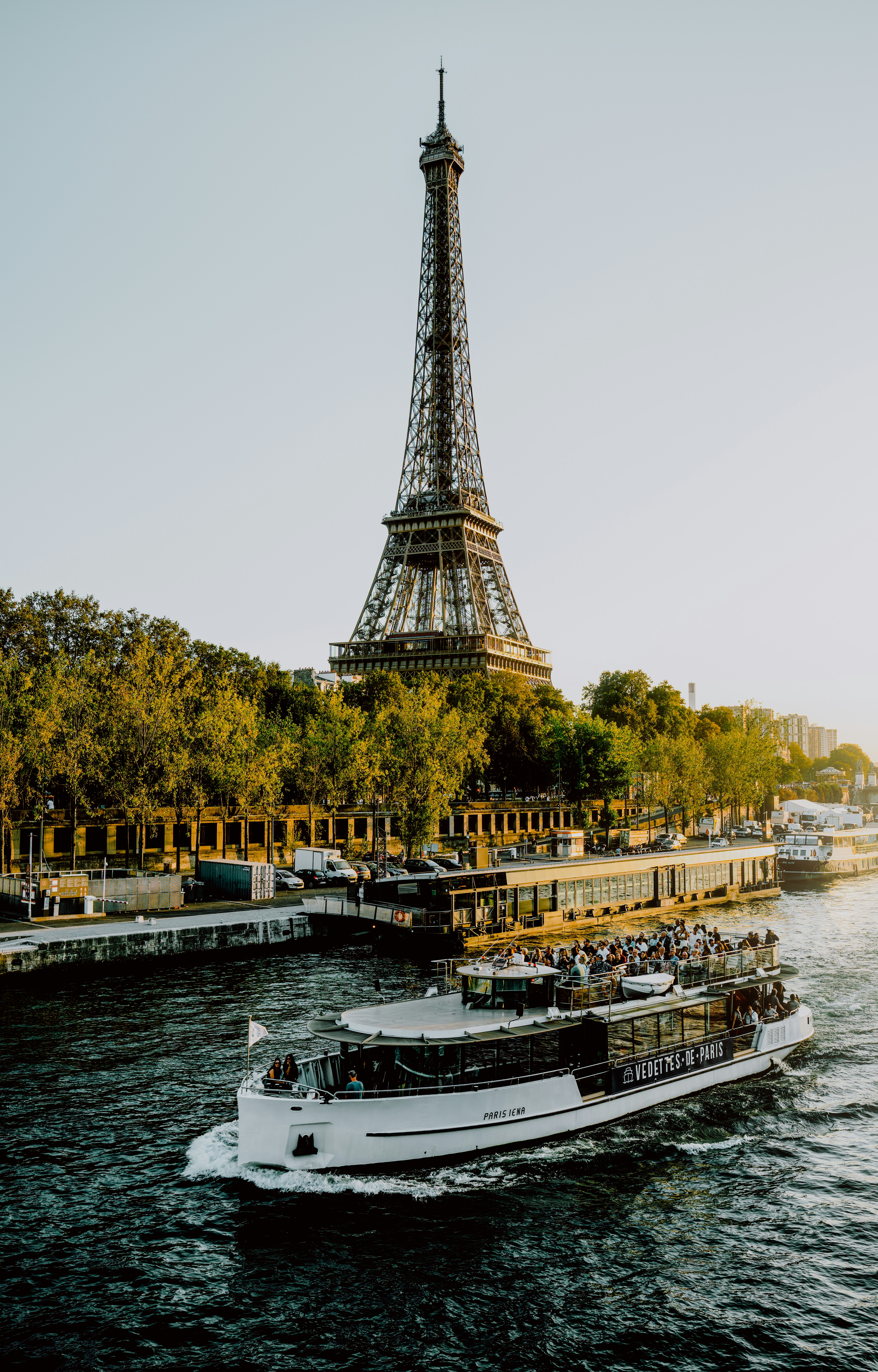Eiffel Silhouette Over the Seine: Tour Boats at Golden Hour