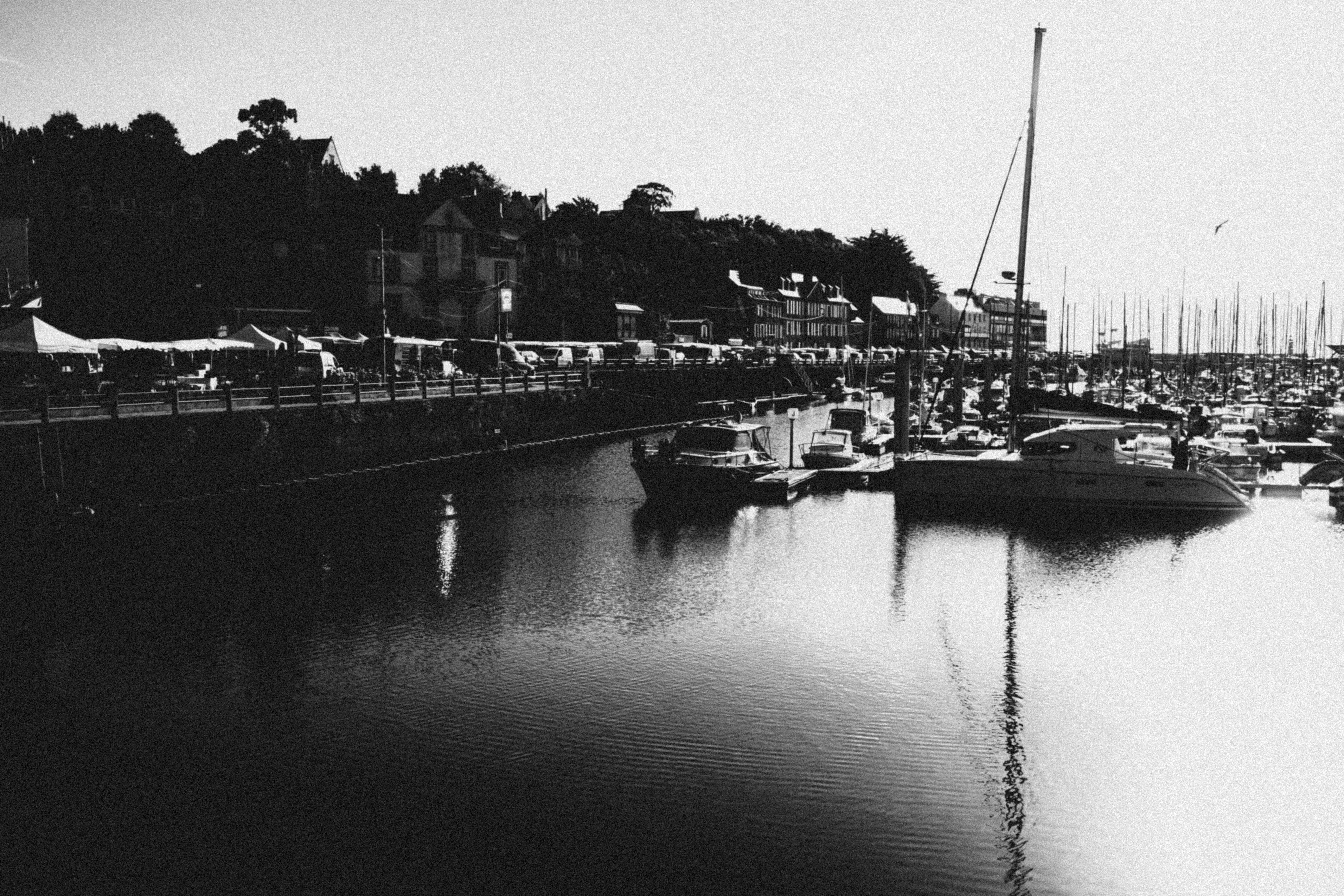 Harbor Silhouette: Boats at Dusk Along a Quiet Waterfront