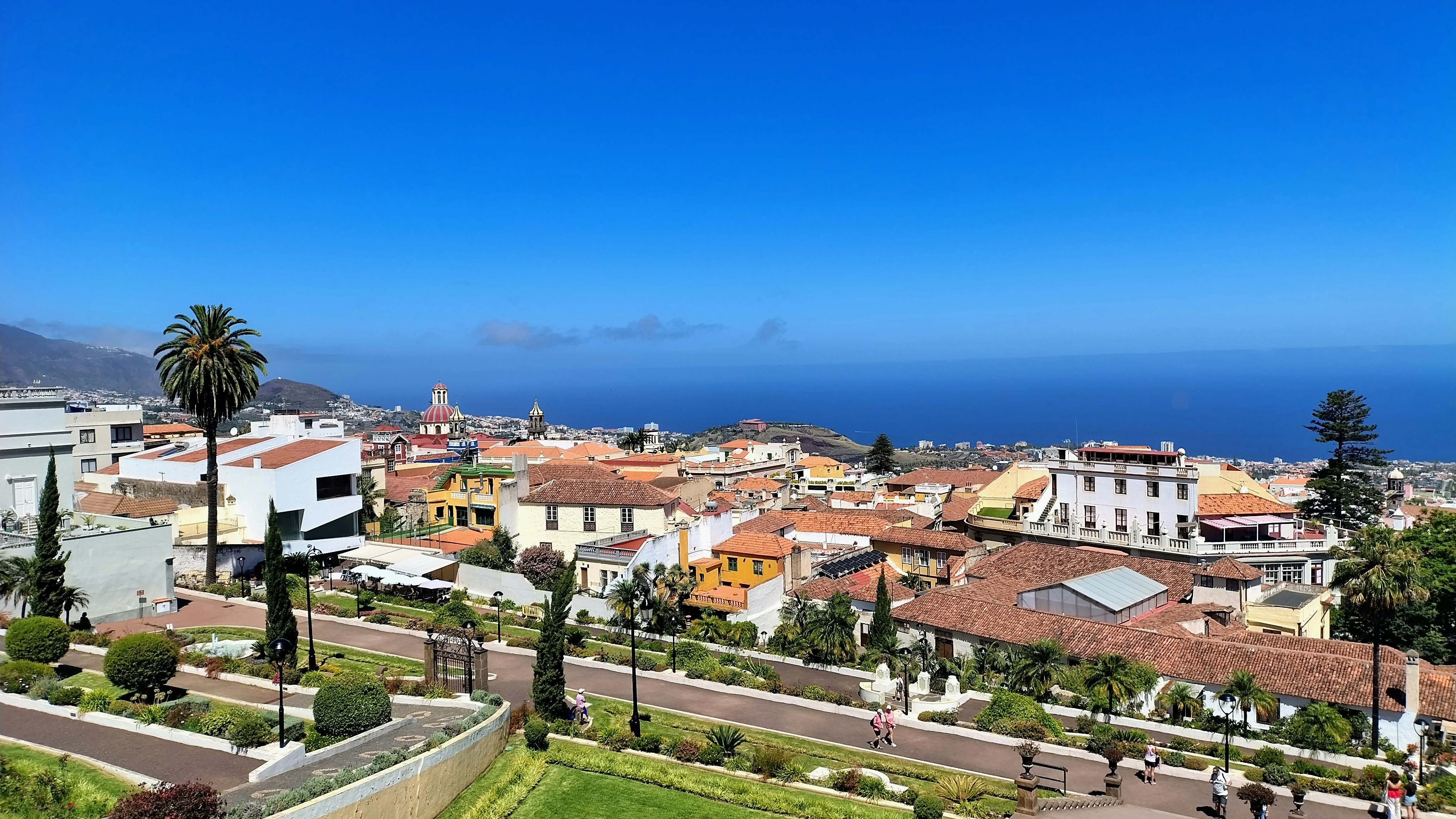 Sunny Coastal Village Unfolding Toward the Sea