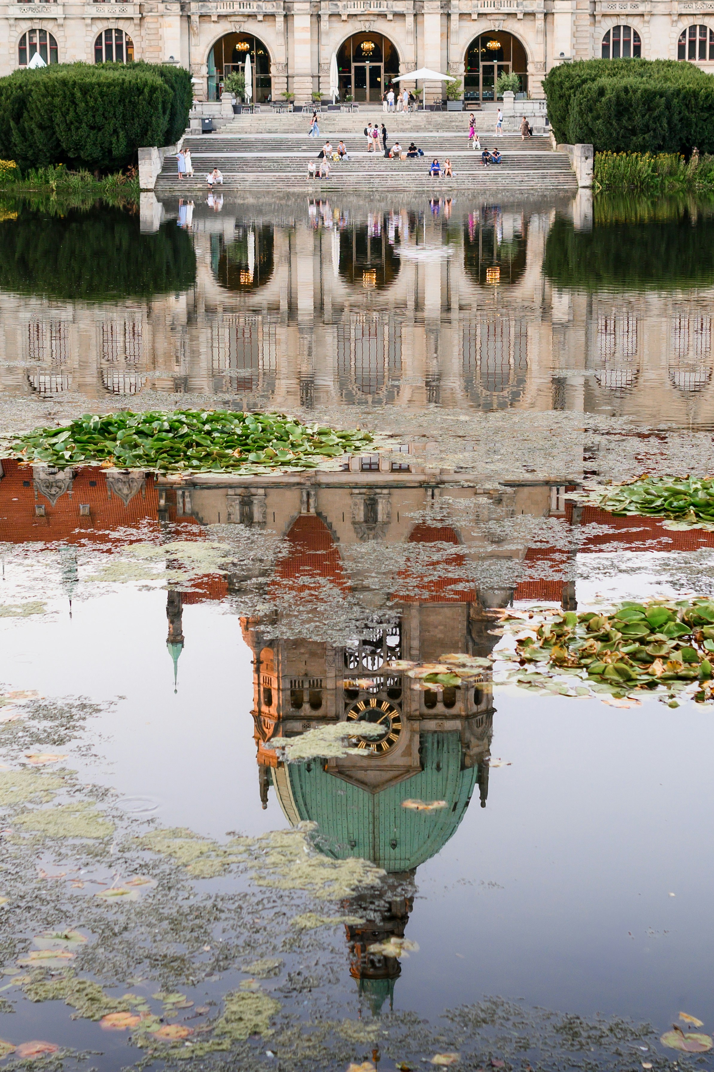 Symmetrical Reflections: Clock Tower Billing Above a Tranquil Canal