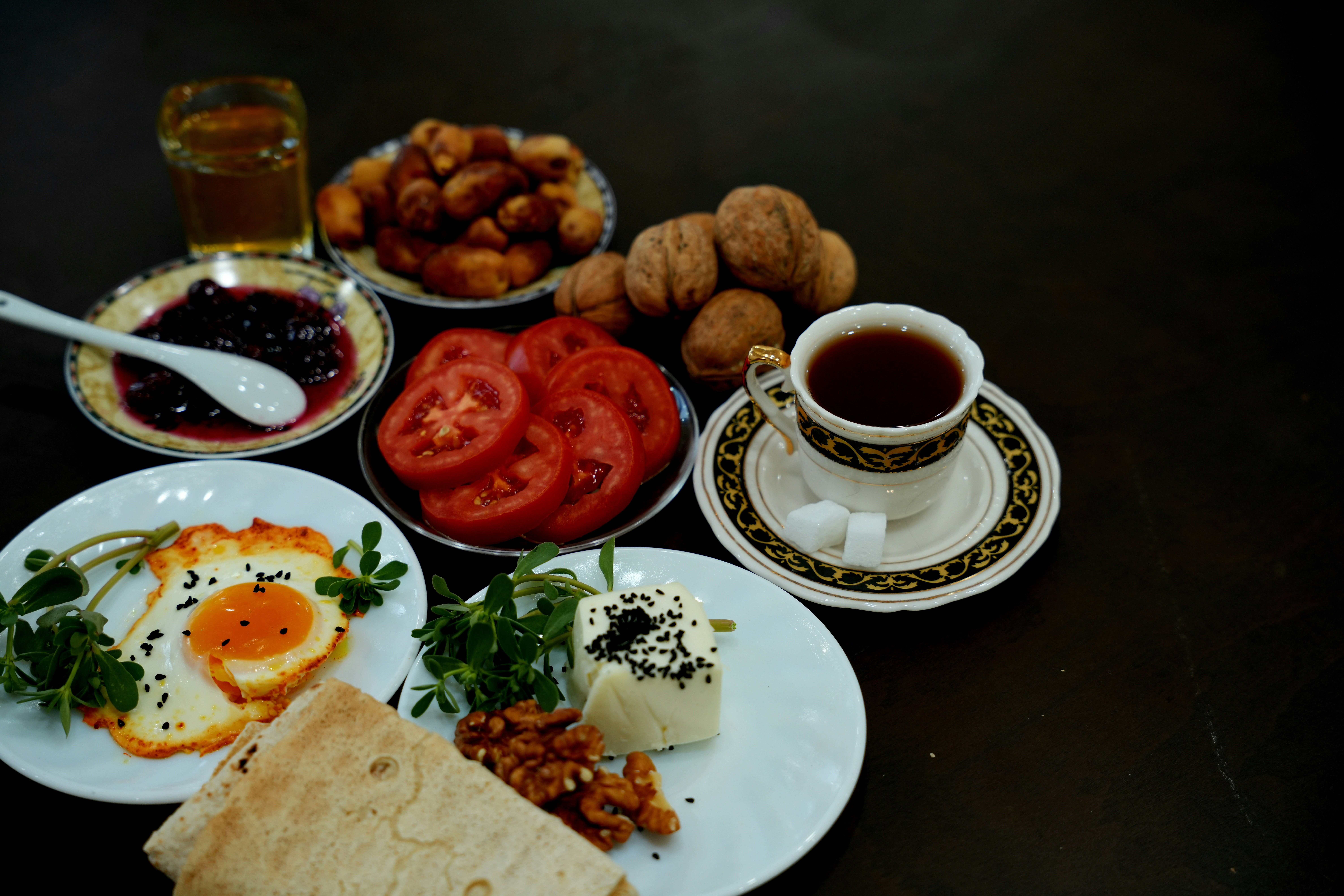 Sunlit Spread: A Rustic Morning Tea with Eggs, Tomato, and Nuts