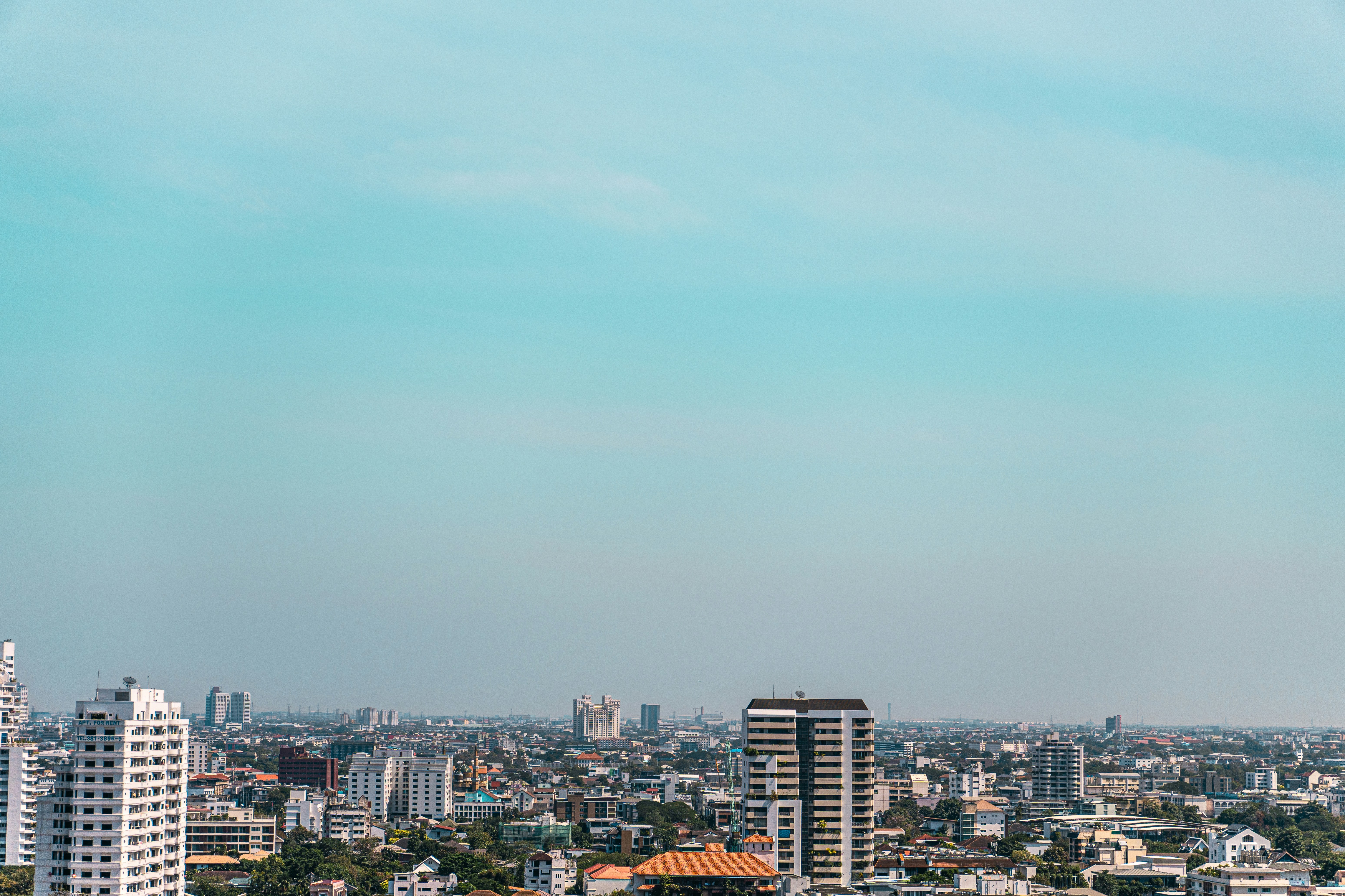 City Crest at Noon: Horizontal Horizon Over a Quiet Skyline