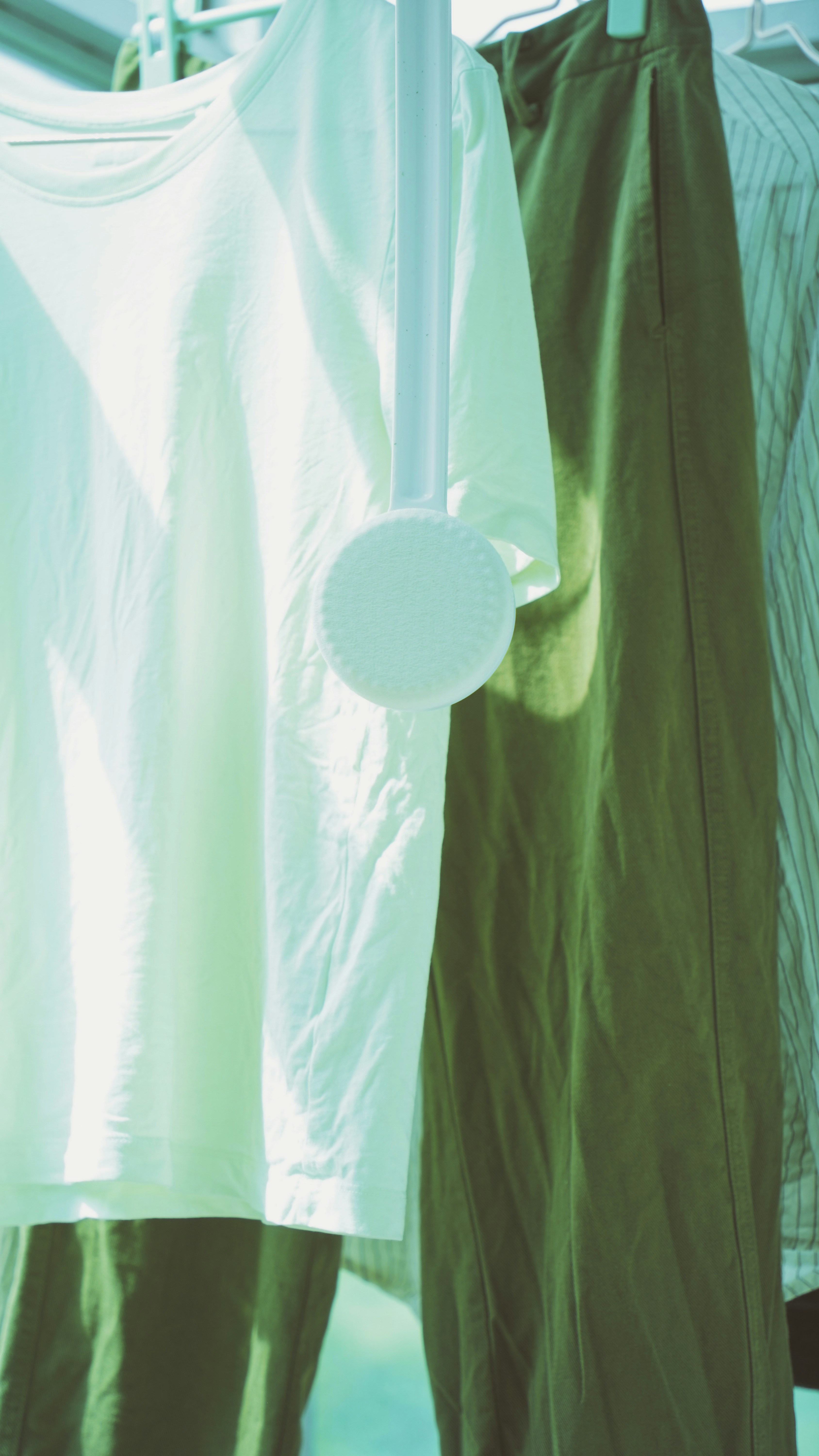 Pastel Laundry: A Close-Up of Draped Whites and Greens