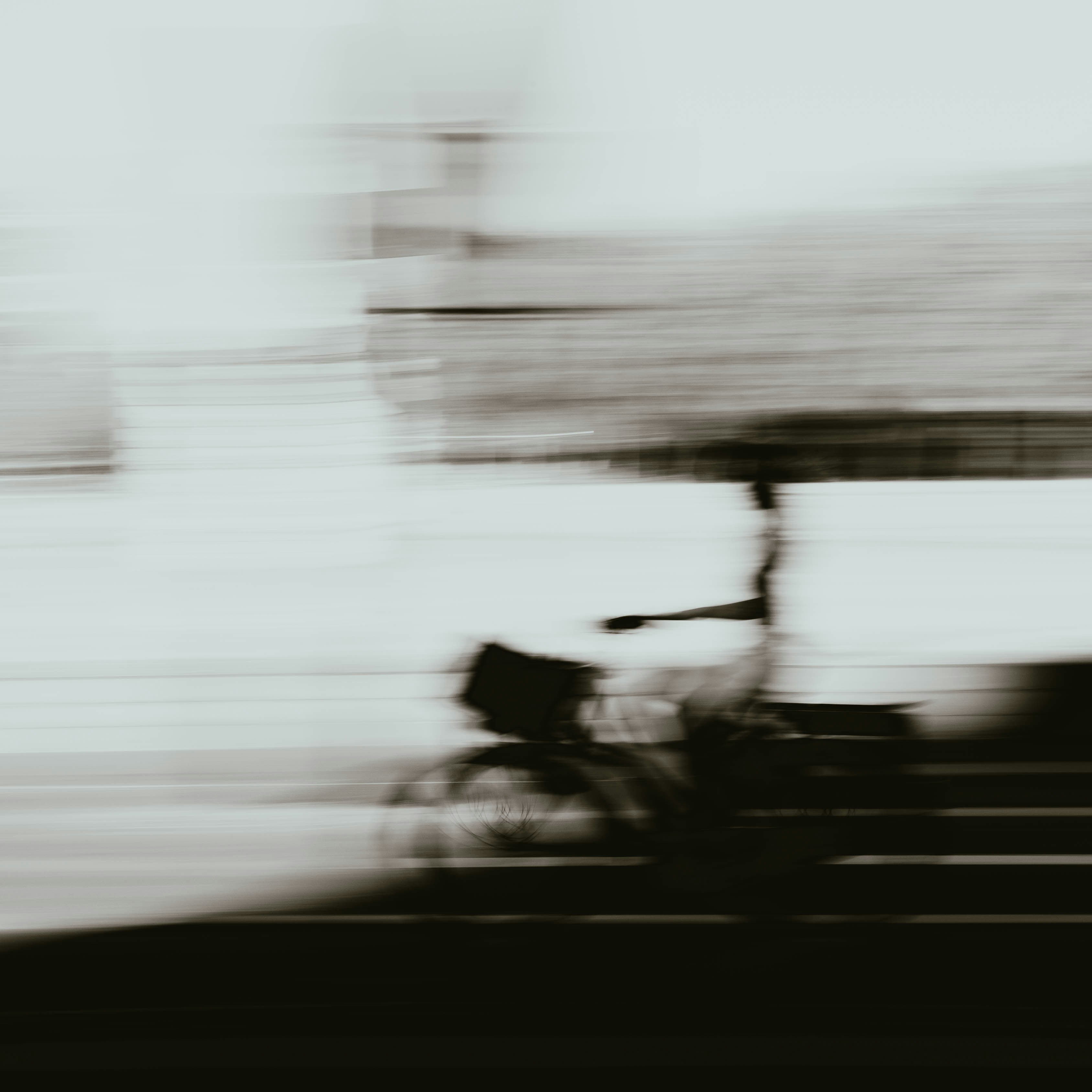 Blurry Rally: A Motion-Blur Portrait of a Bicycle in Transit