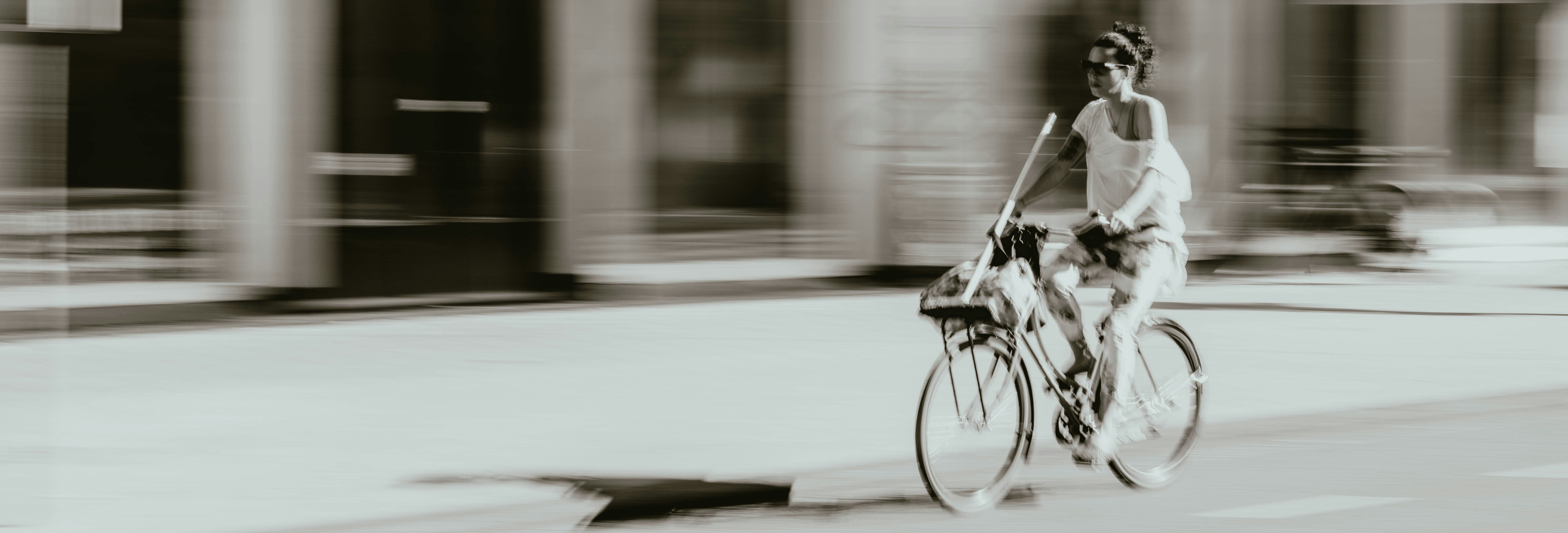 Blurred Commute: Cyclist in Motion Through a City Mesh