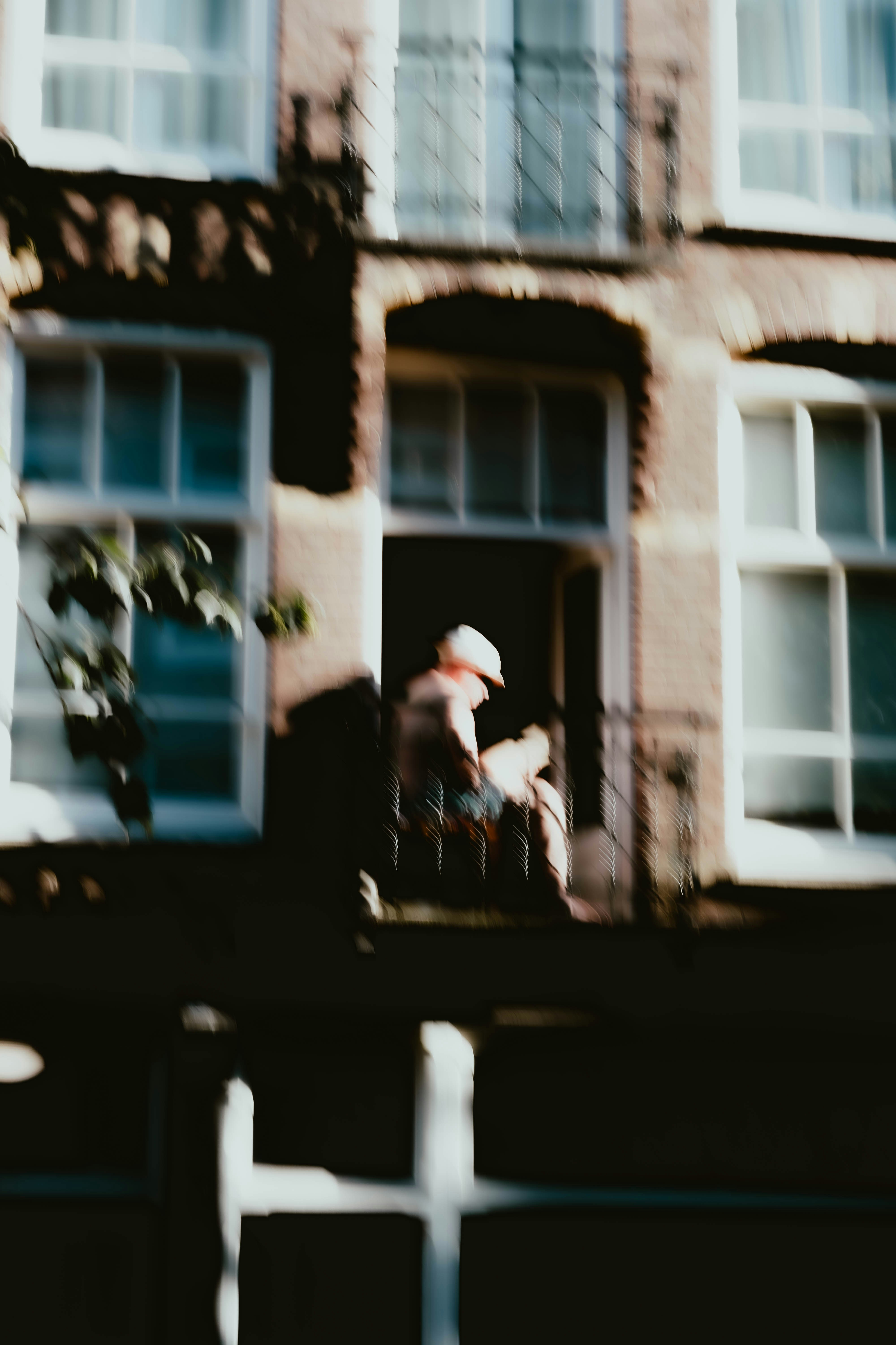 Soft Blur, Quiet Window: A Balcony Portrait in Evening Light