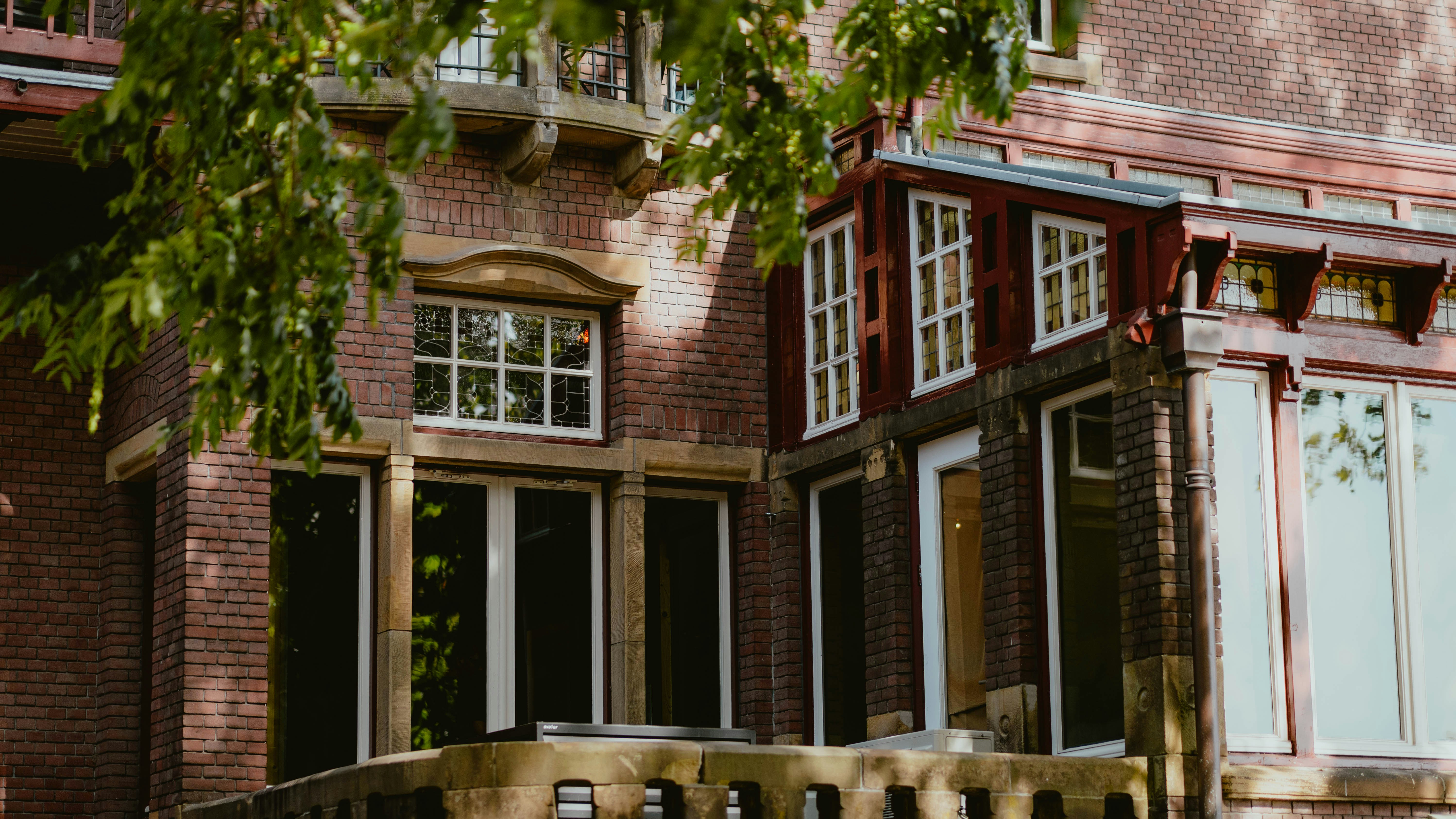 Brick Facade and Sunlit Windows of a Historic Terrace