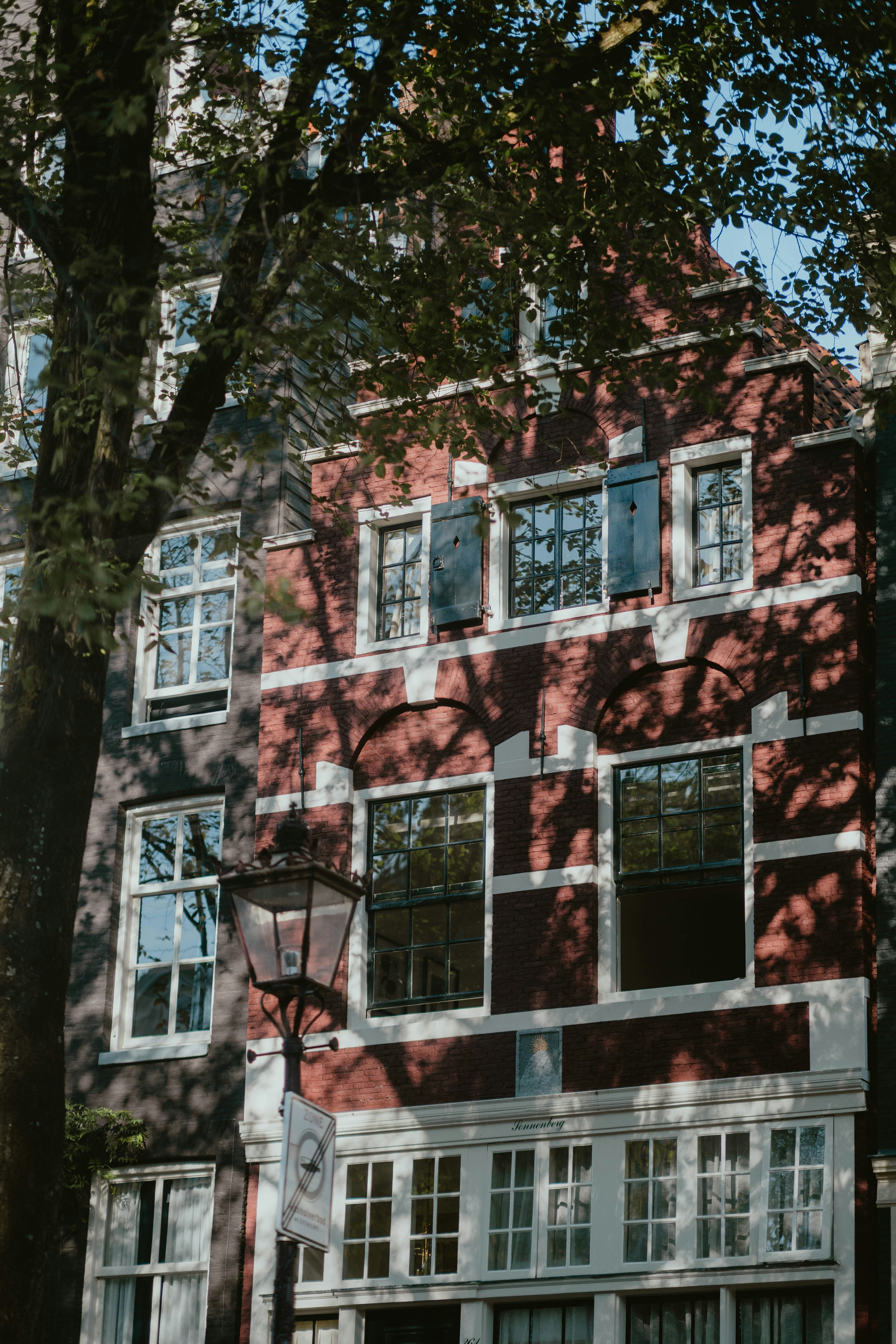 Shadows and Brickwork: A City Building in Autumn Light
