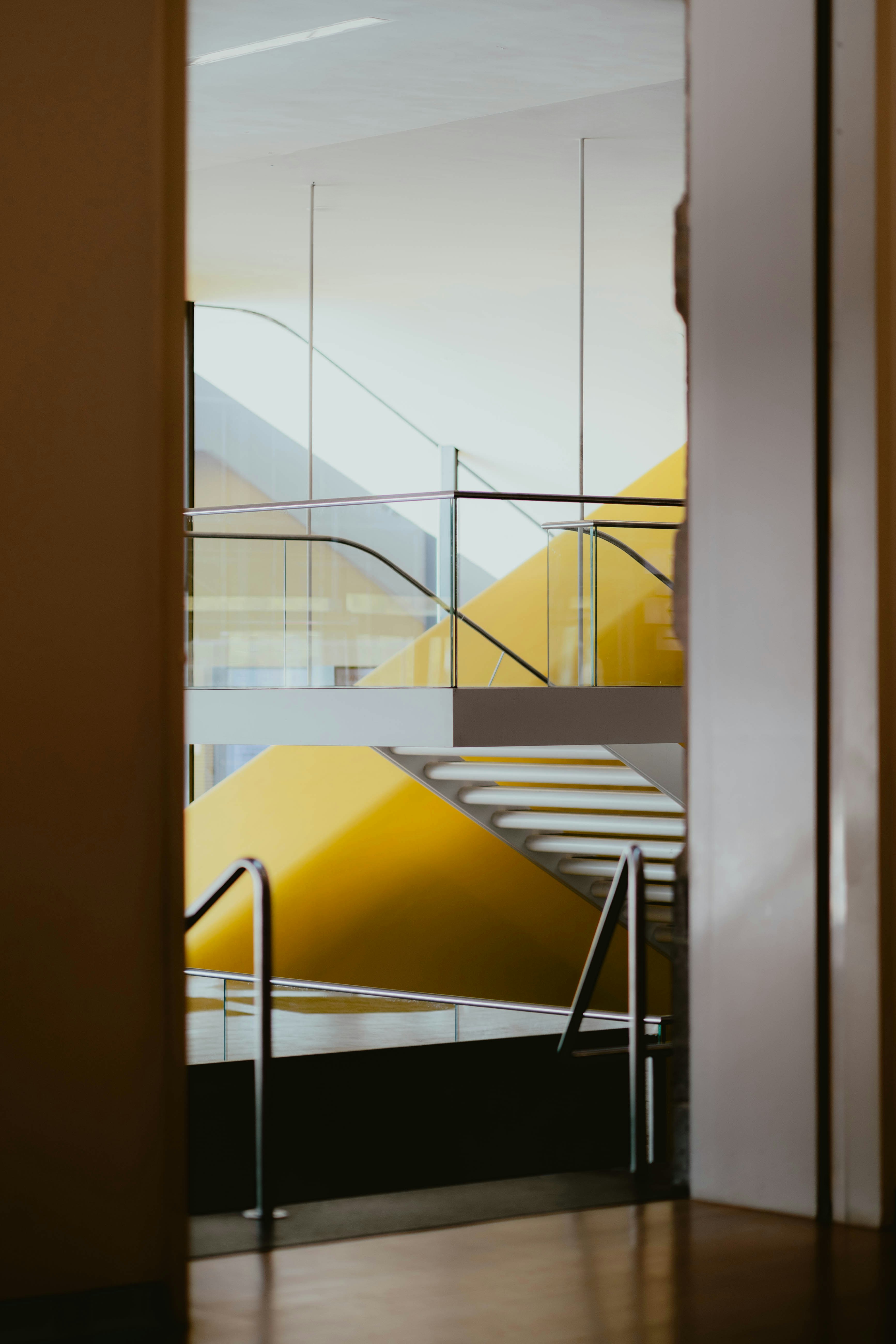 Yellow Stairwell Through Framed Gaps
