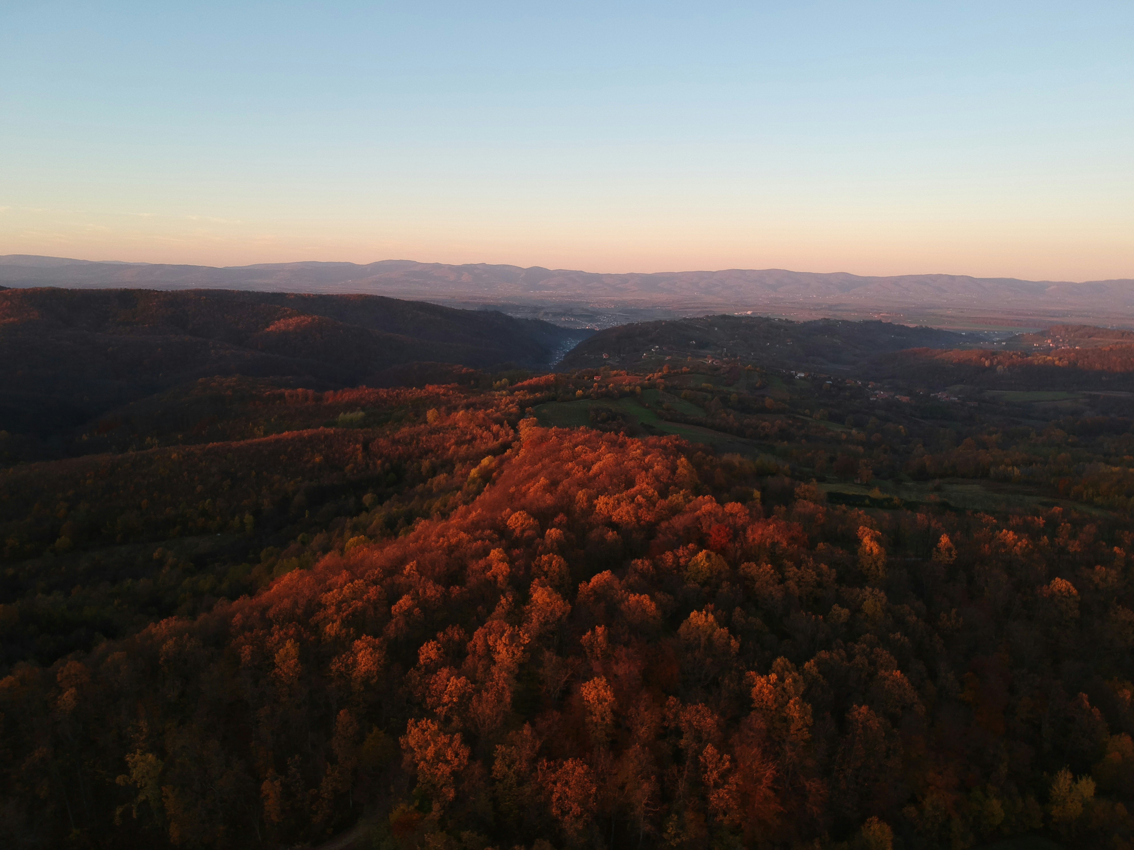 Autumn Ridge: Golden Canopy Over Valley Dusk