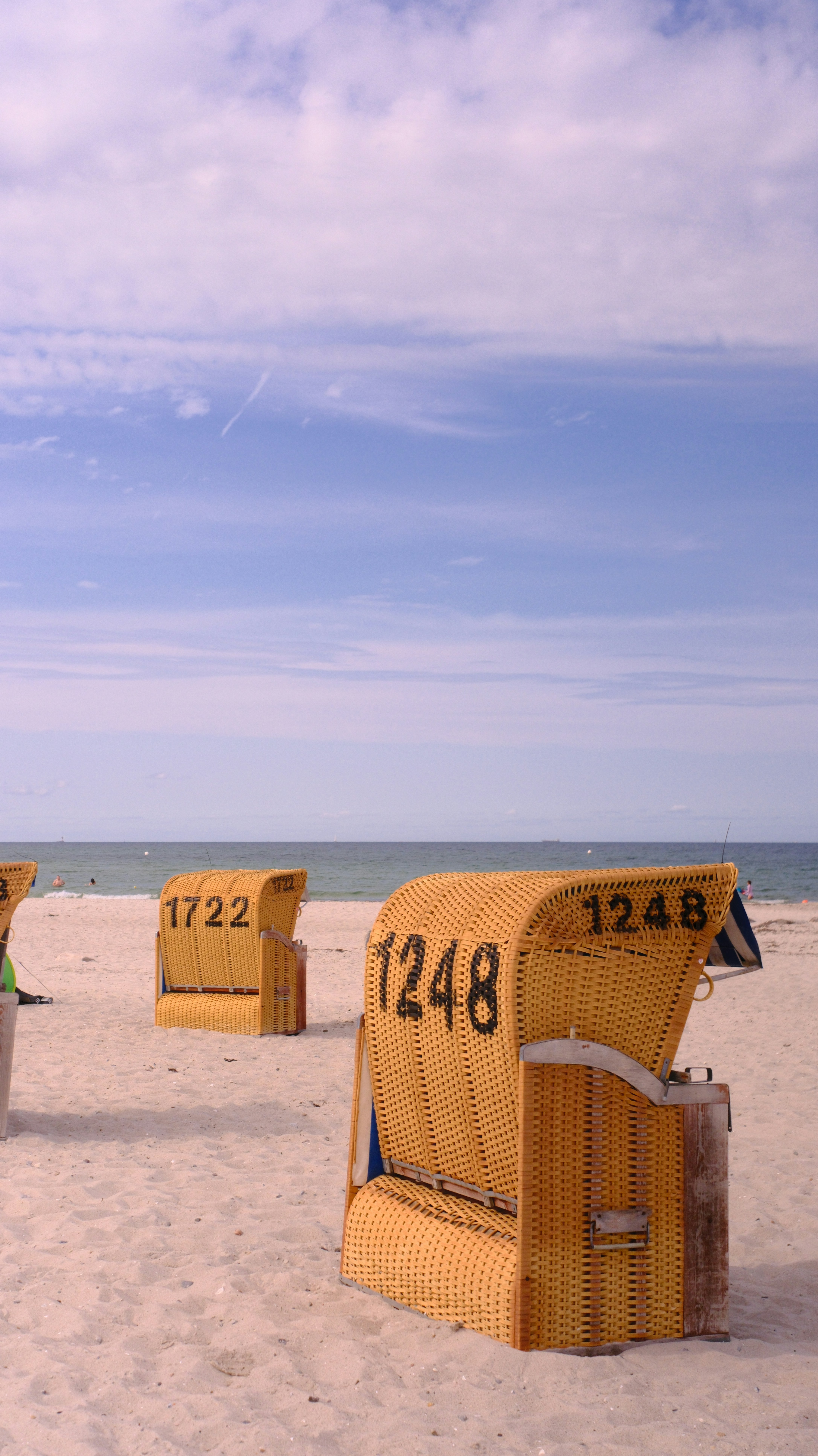 Numbered Beach Chairs Basking in Quiet Sunshine