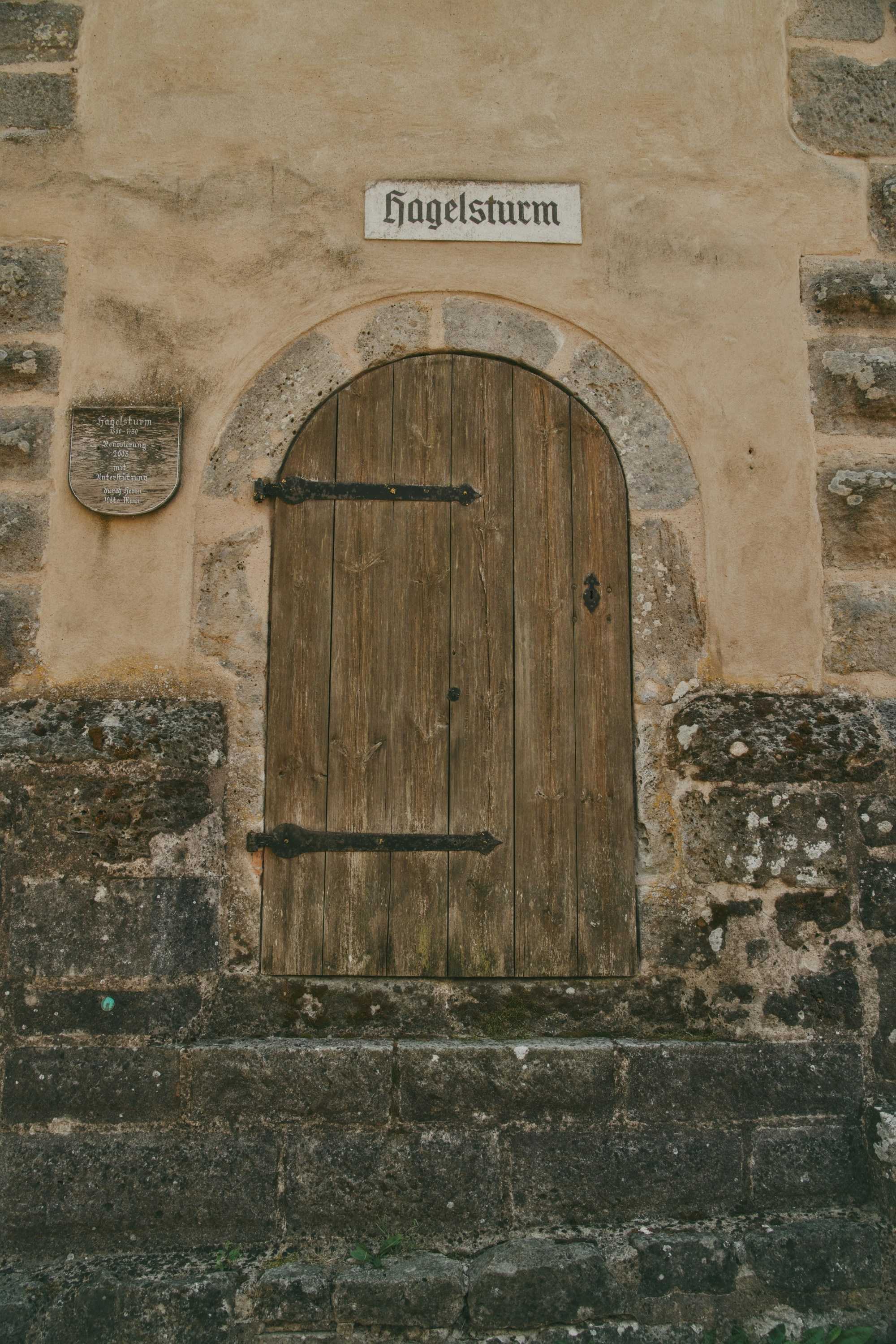 Weathered Archway Gate in Stone facade